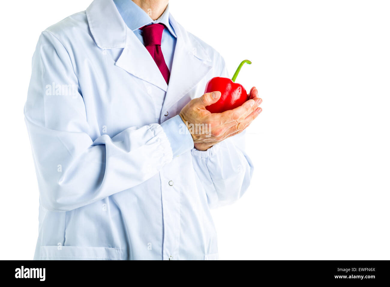 Caucasian male doctor dressed in white coat, blue shirt and red tie is ...