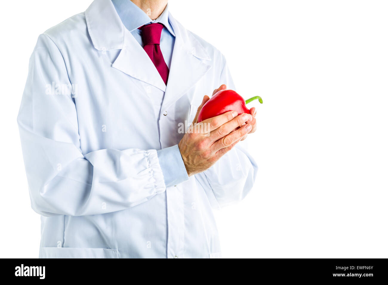 Caucasian male doctor dressed in white coat, blue shirt and red tie is ...