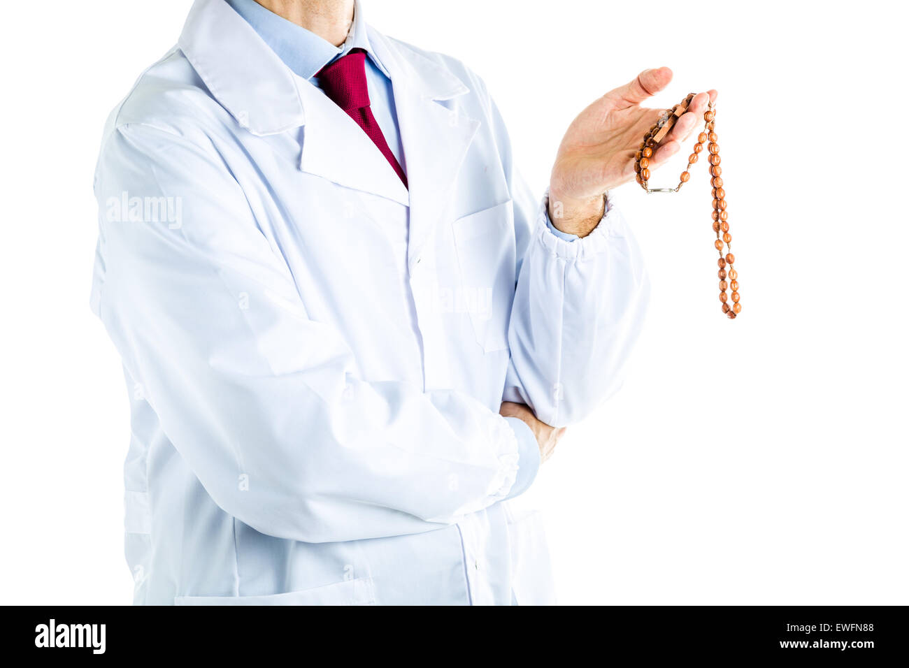 Caucasian male doctor dressed in white coat, blue shirt and red tie is ...