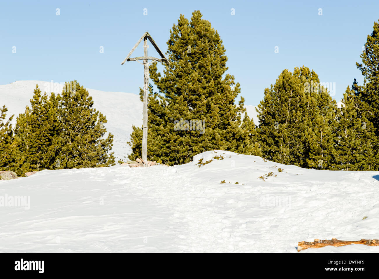 A wood carved statue of the Crucifixion of Jesus Christ with background ...
