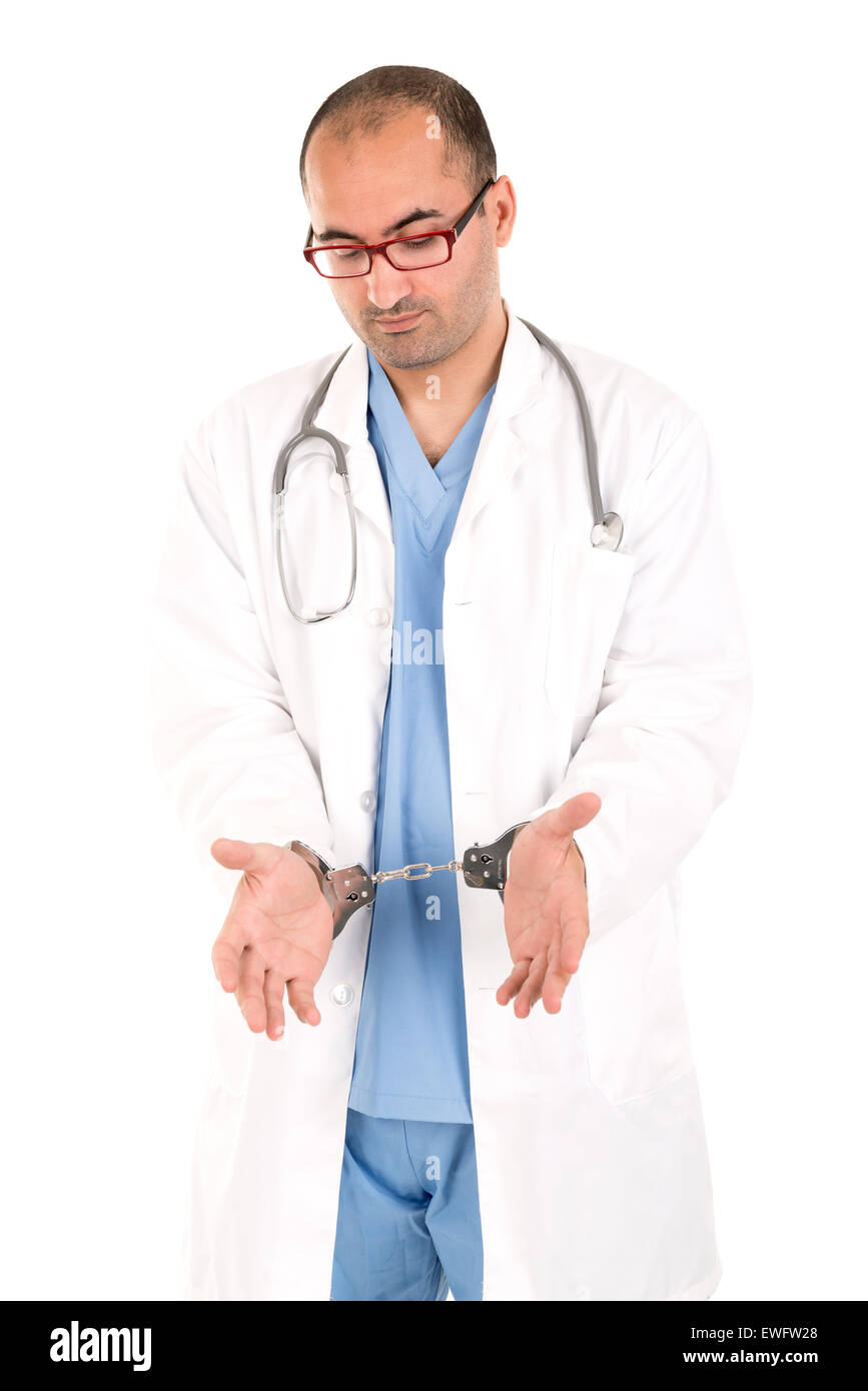 Male doctor in handcuffs isolated in a white background Stock Photo - Alamy