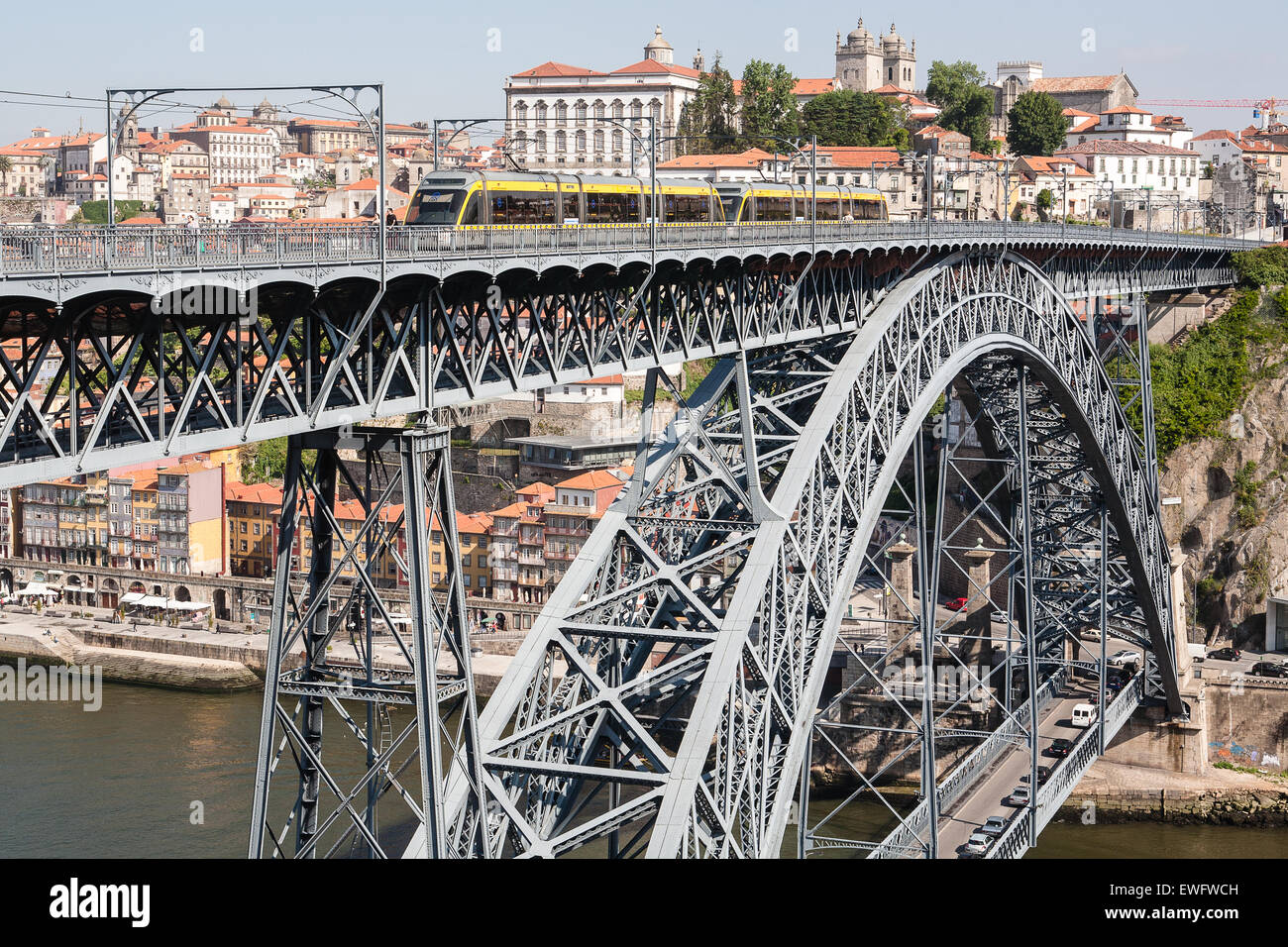 Metro rail train on top of Dom Luis I Bridge, which is also a walkway ...