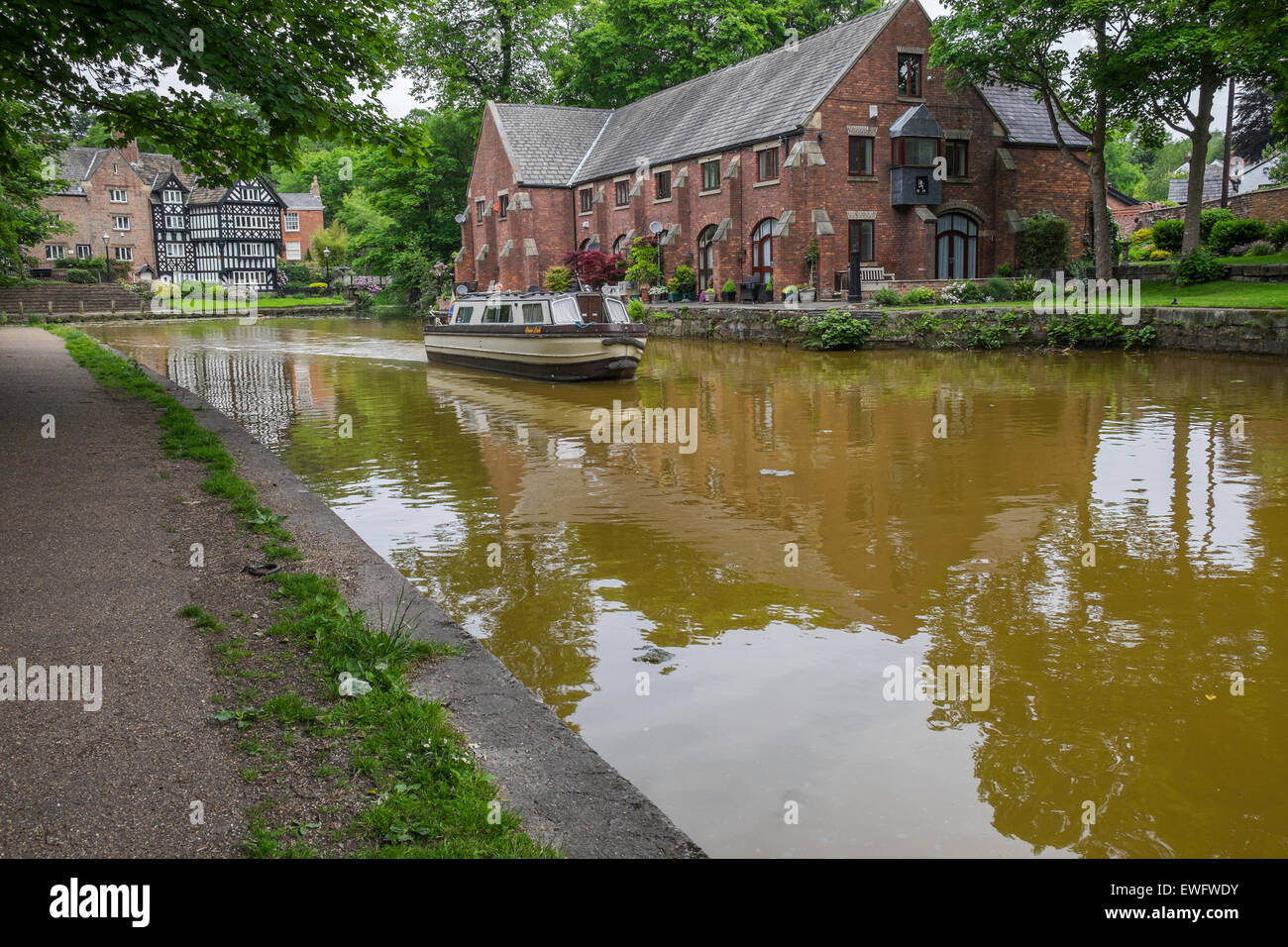 Bridgewater Canal with tow path and canal boats in centre of the ca ...