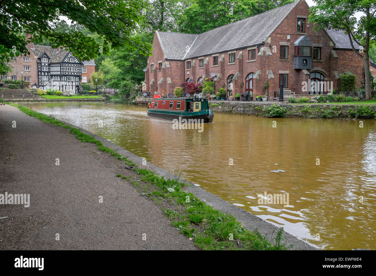 Bridgewater Canal with tow path and canal boats in centre of the canal ...