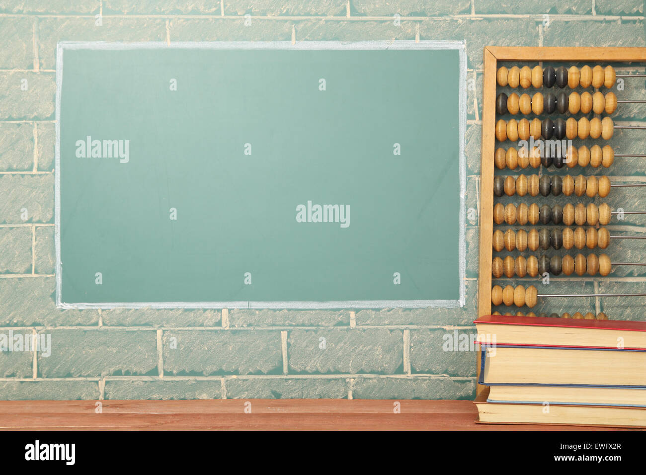 Classroom, books and abacus about blackboard with copy space Stock ...