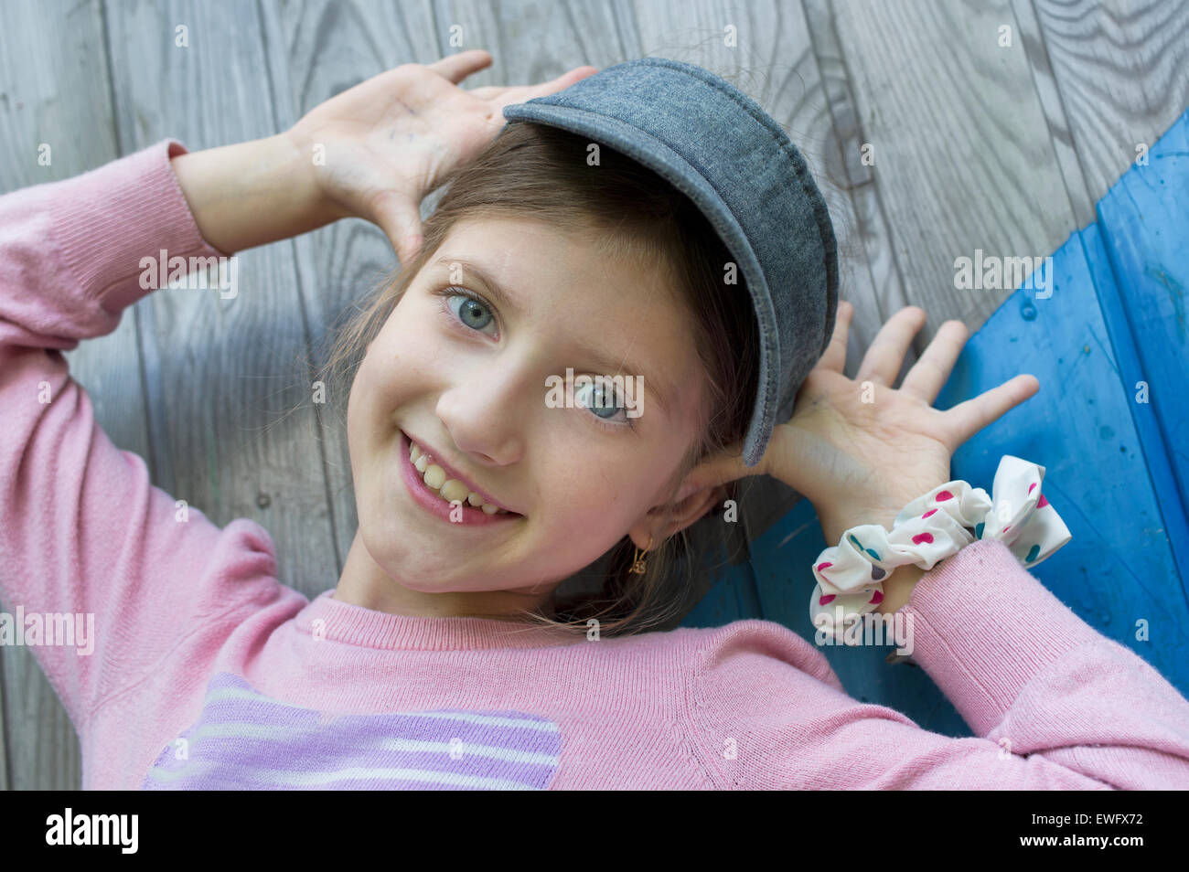Girl making face with hands up Stock Photo - Alamy