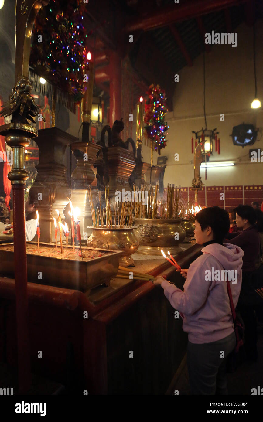Devotees inside temple hi-res stock photography and images - Alamy
