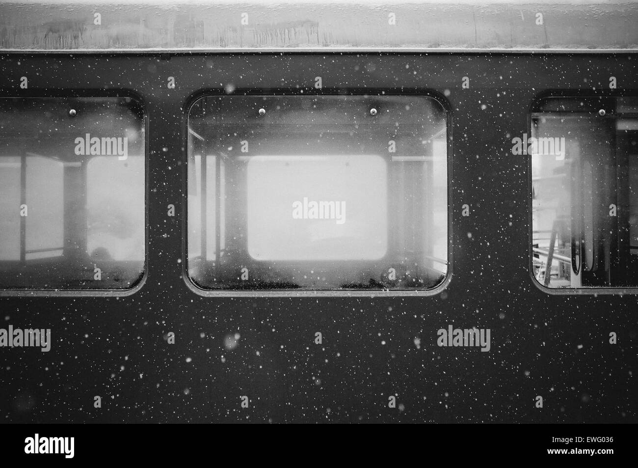 An outside view through the windows of a train, showcasing the passing ...