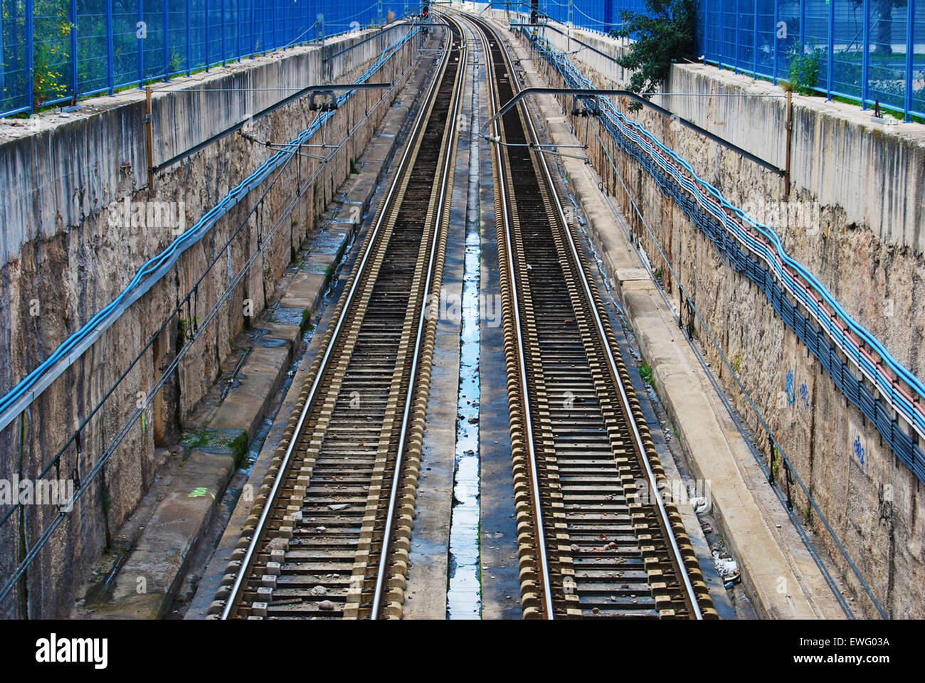 This image shows a path of an empty rail line stretching through a ...