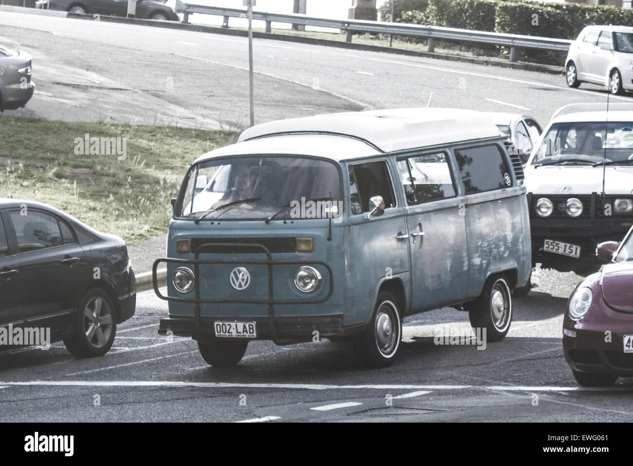 A classic Volkswagen Van at an intersection, showcasing its iconic ...