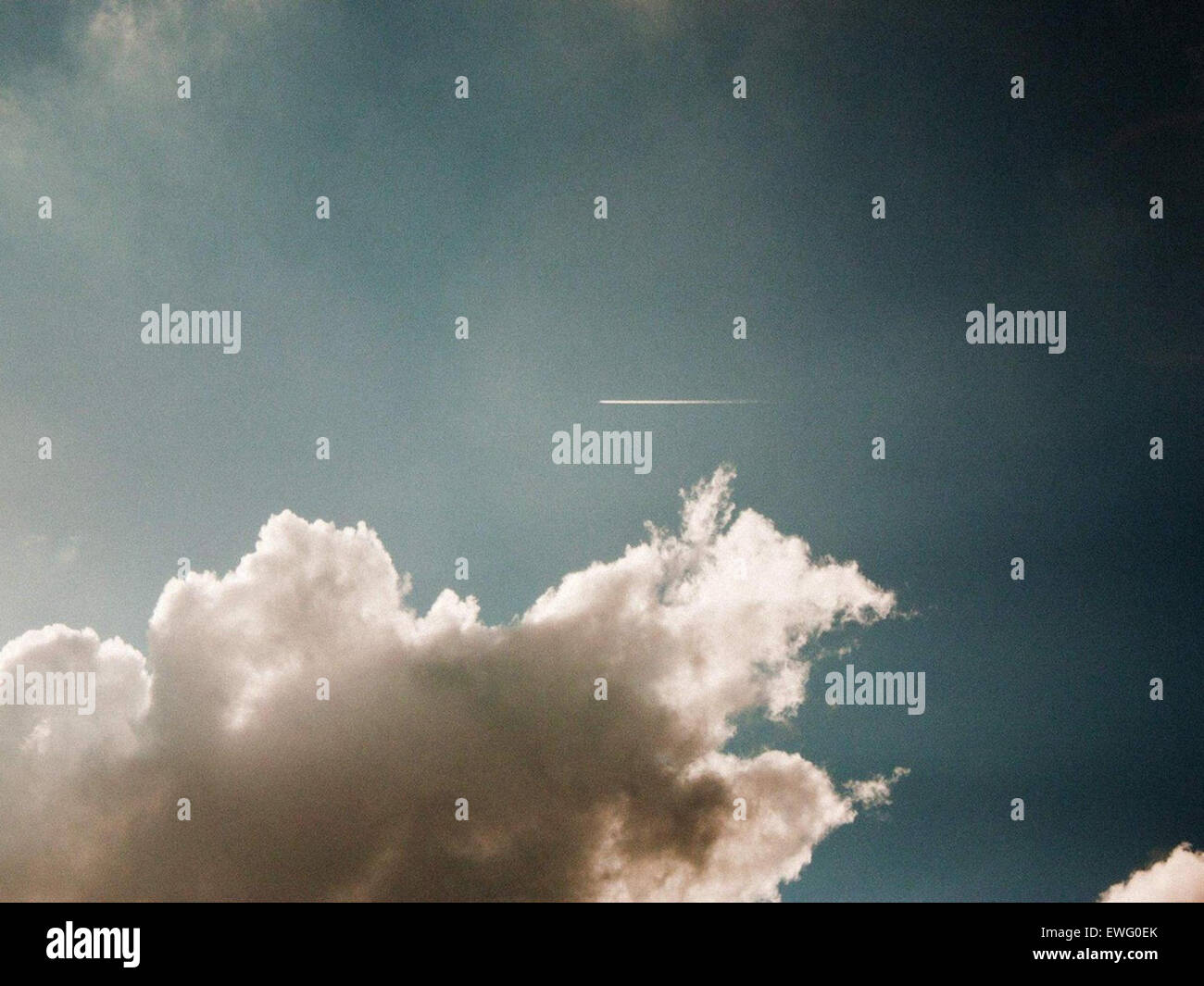 A clear view of cumulus clouds in a deep blue sky, characterized by ...