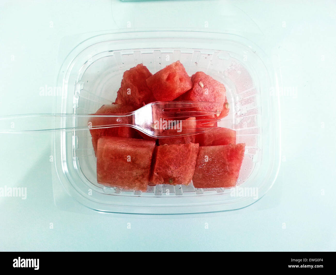 Freshly cut watermelon chunks placed in a ready-to-eat container ...