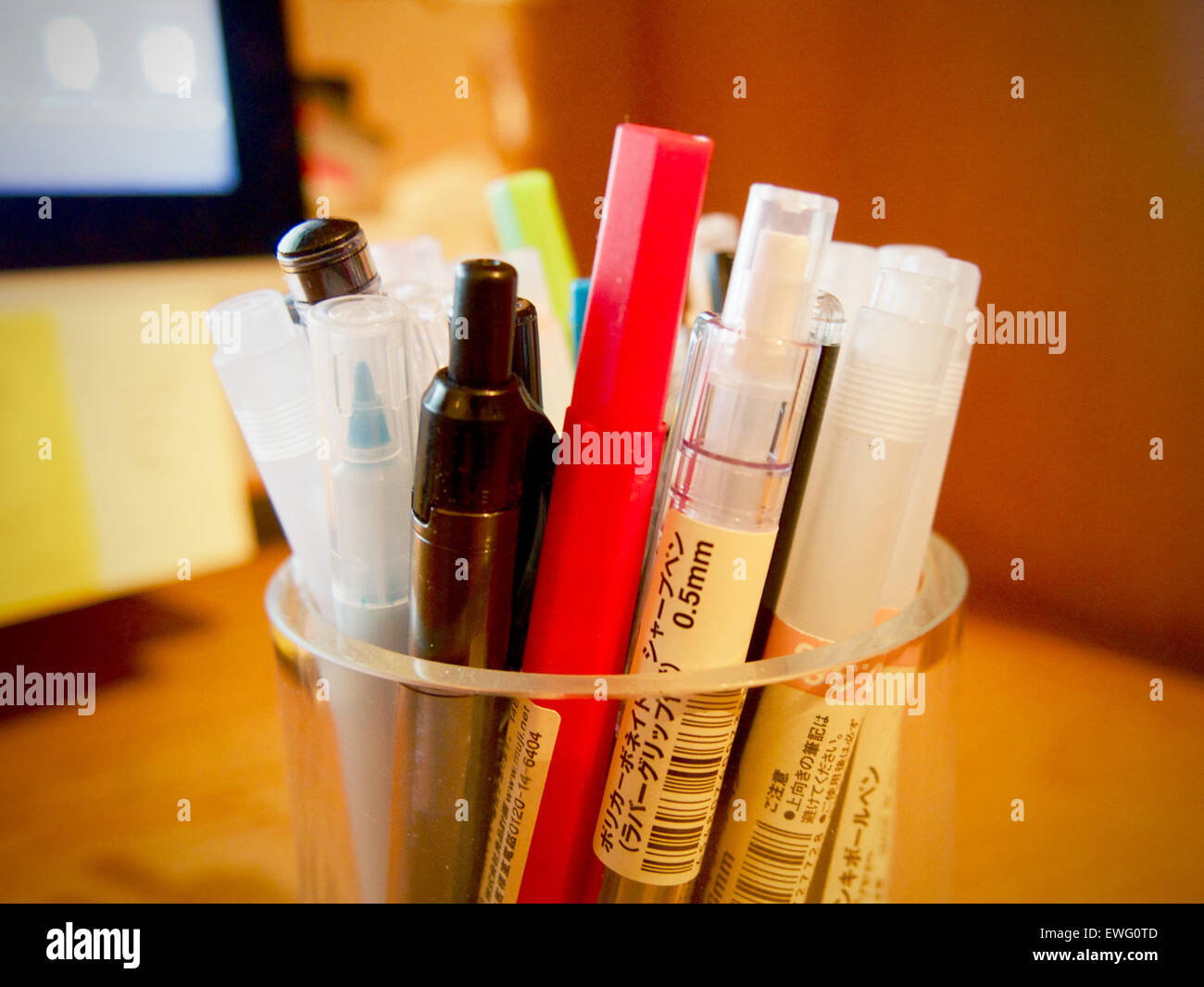 A collection of pens and markers arranged together, showcasing various ...