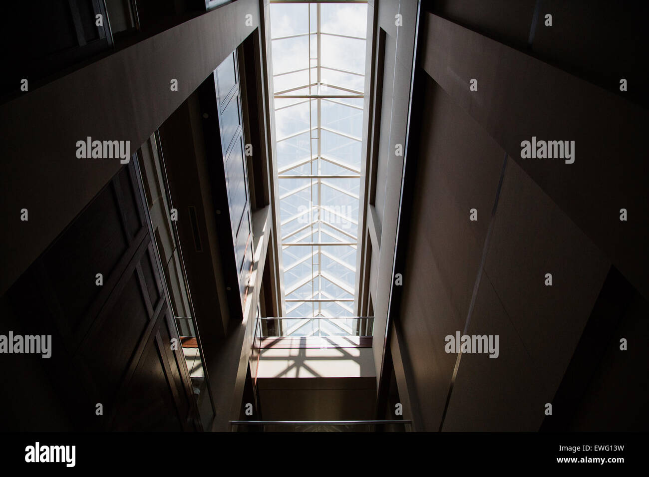 An interior shot looking up at a skylight inside a building. The ...