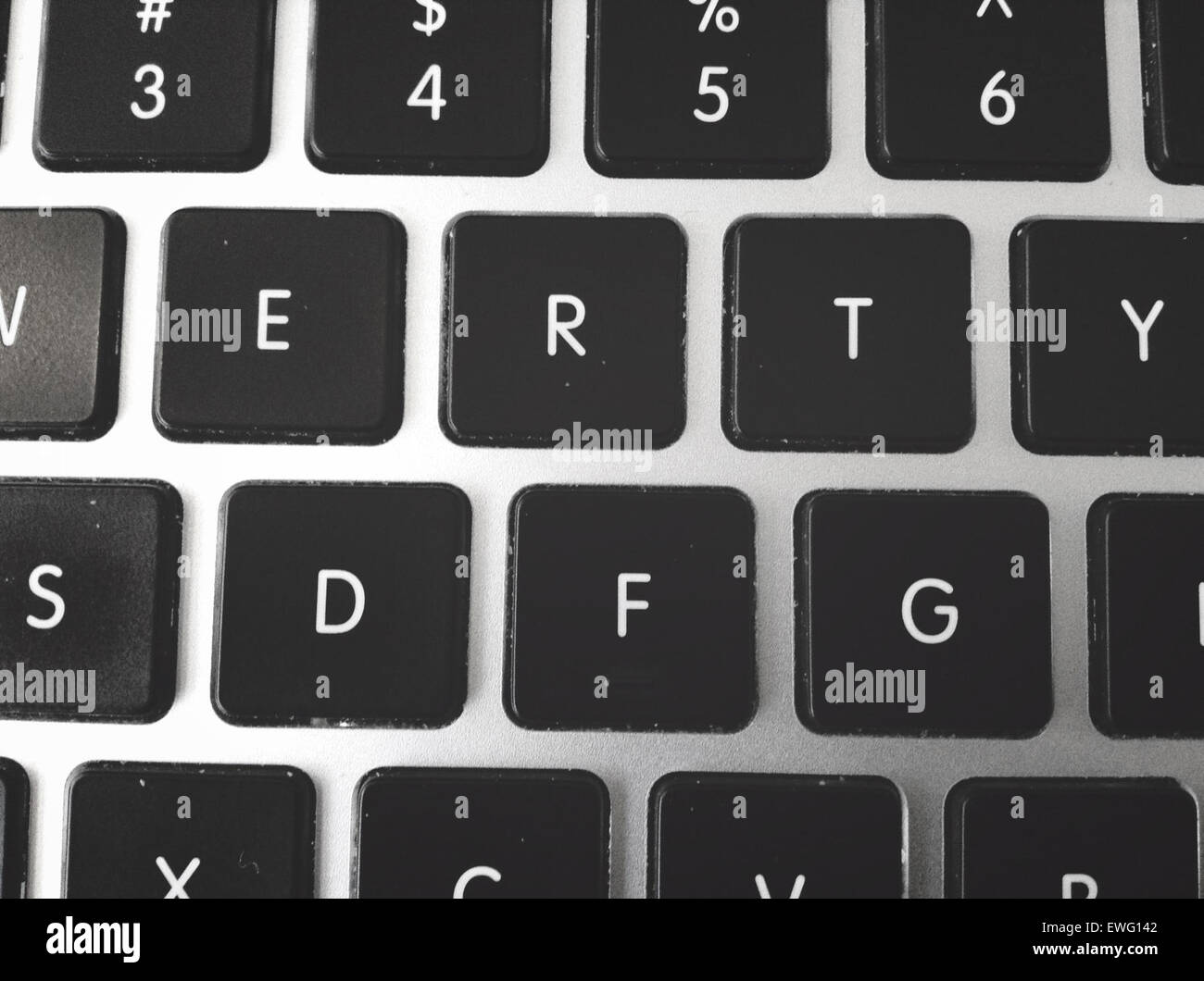 A close-up view of computer keys, showing the individual letters and ...