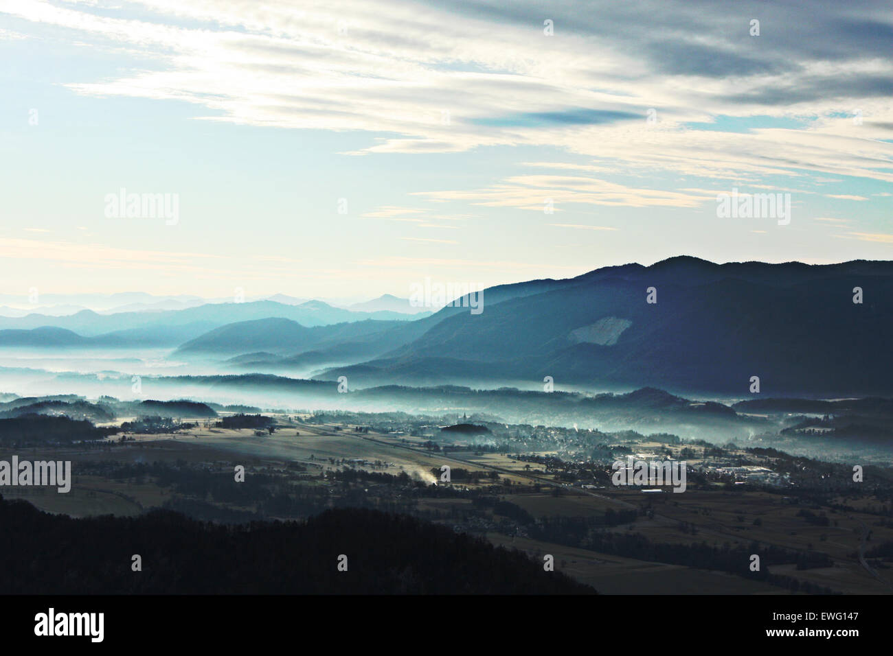 A picturesque landscape of a valley with a village nestled within it ...