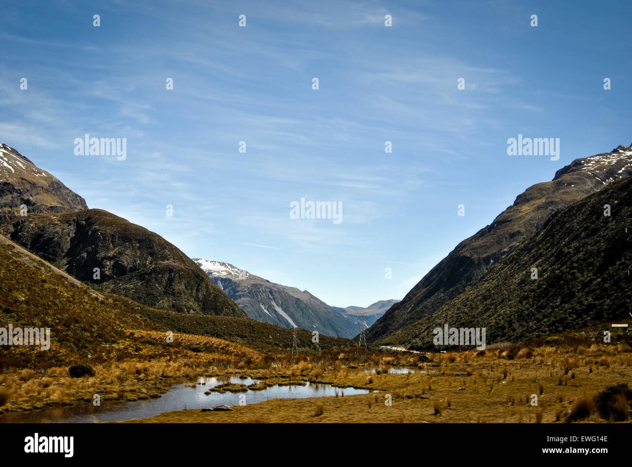 A scenic landscape showcasing a river flowing between two mountain ...