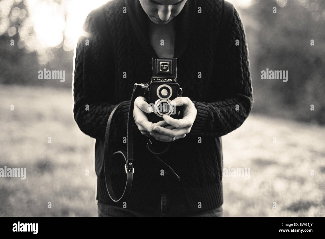 A person is holding the vintage Argus Argoflex E camera, likely taking ...