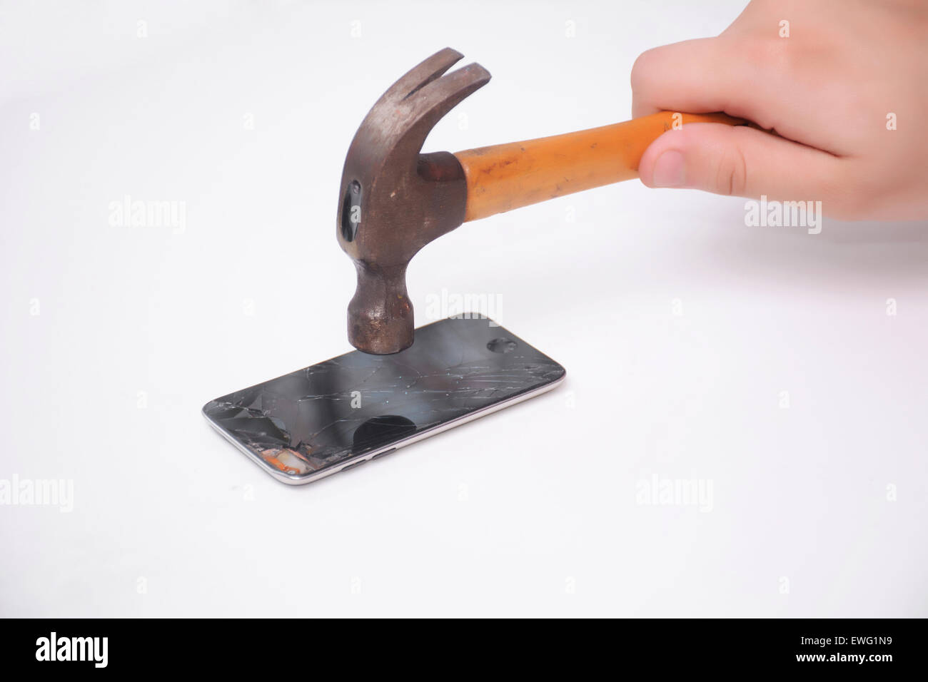 Hammer and smartphone with smashed display, isolated over white ...
