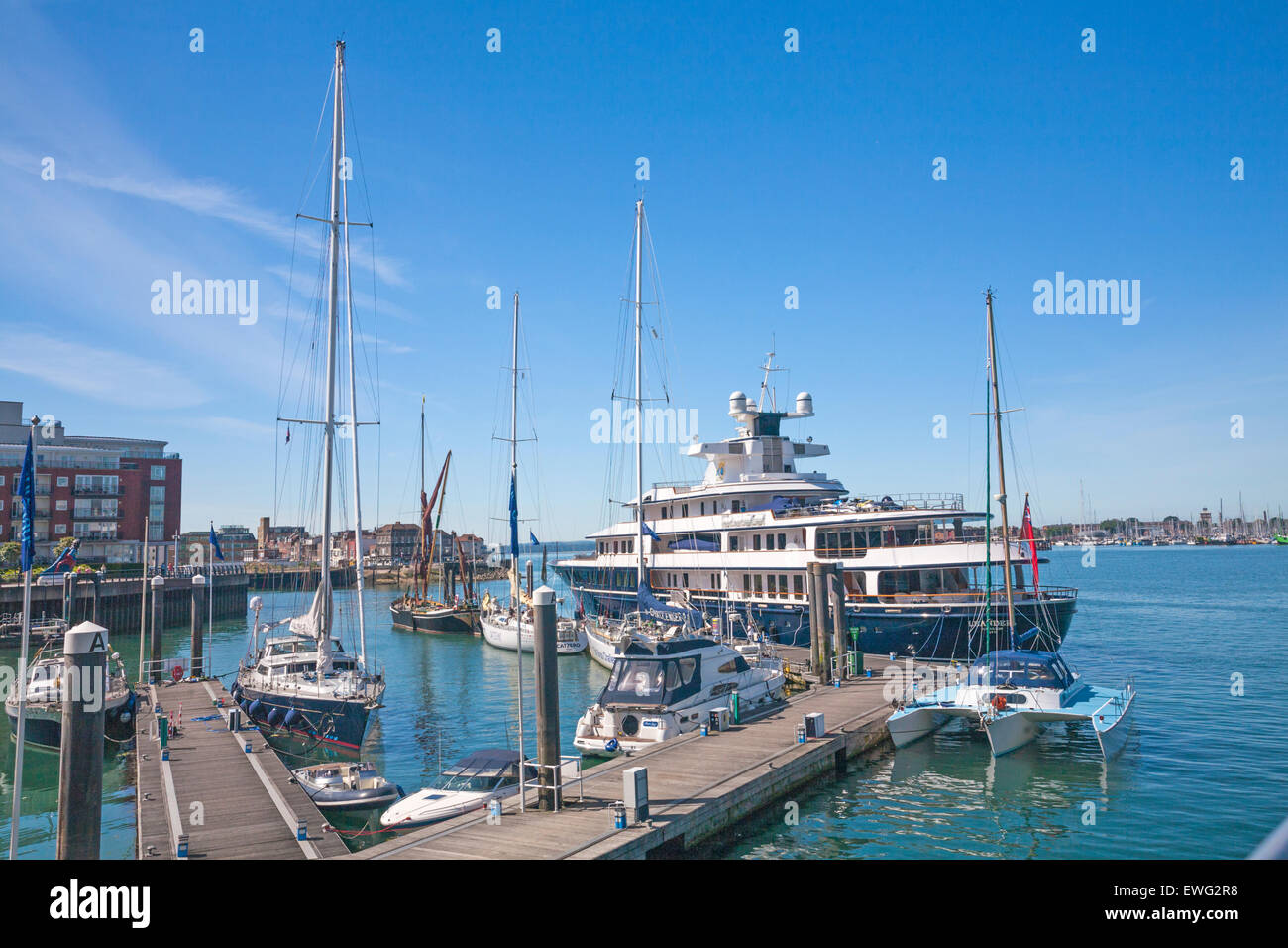 Super yacht Leander G and yachts moored at Portsmouth Harbour in June ...