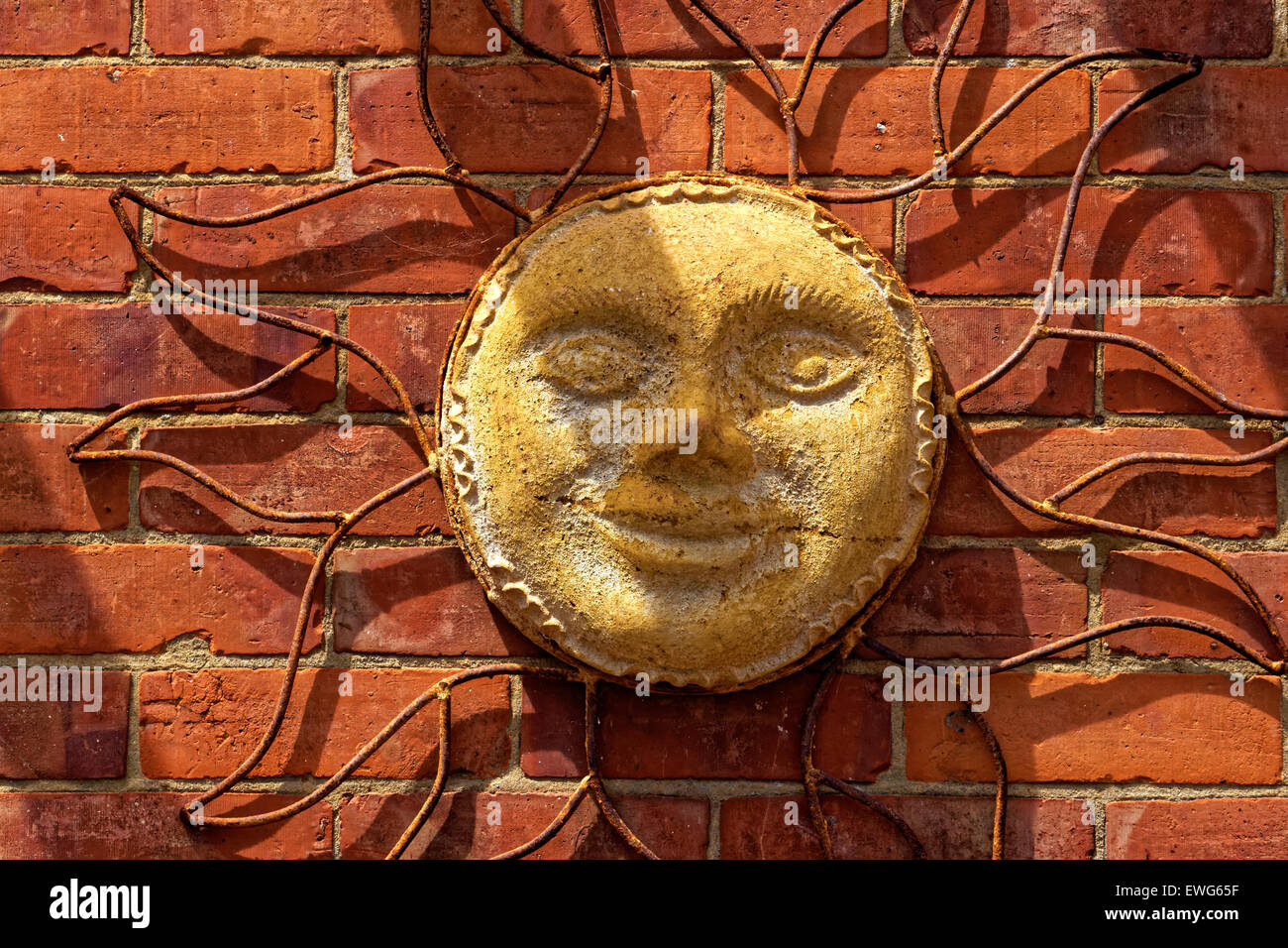 Artistic impression of the sun hanging on wall Stock Photo - Alamy