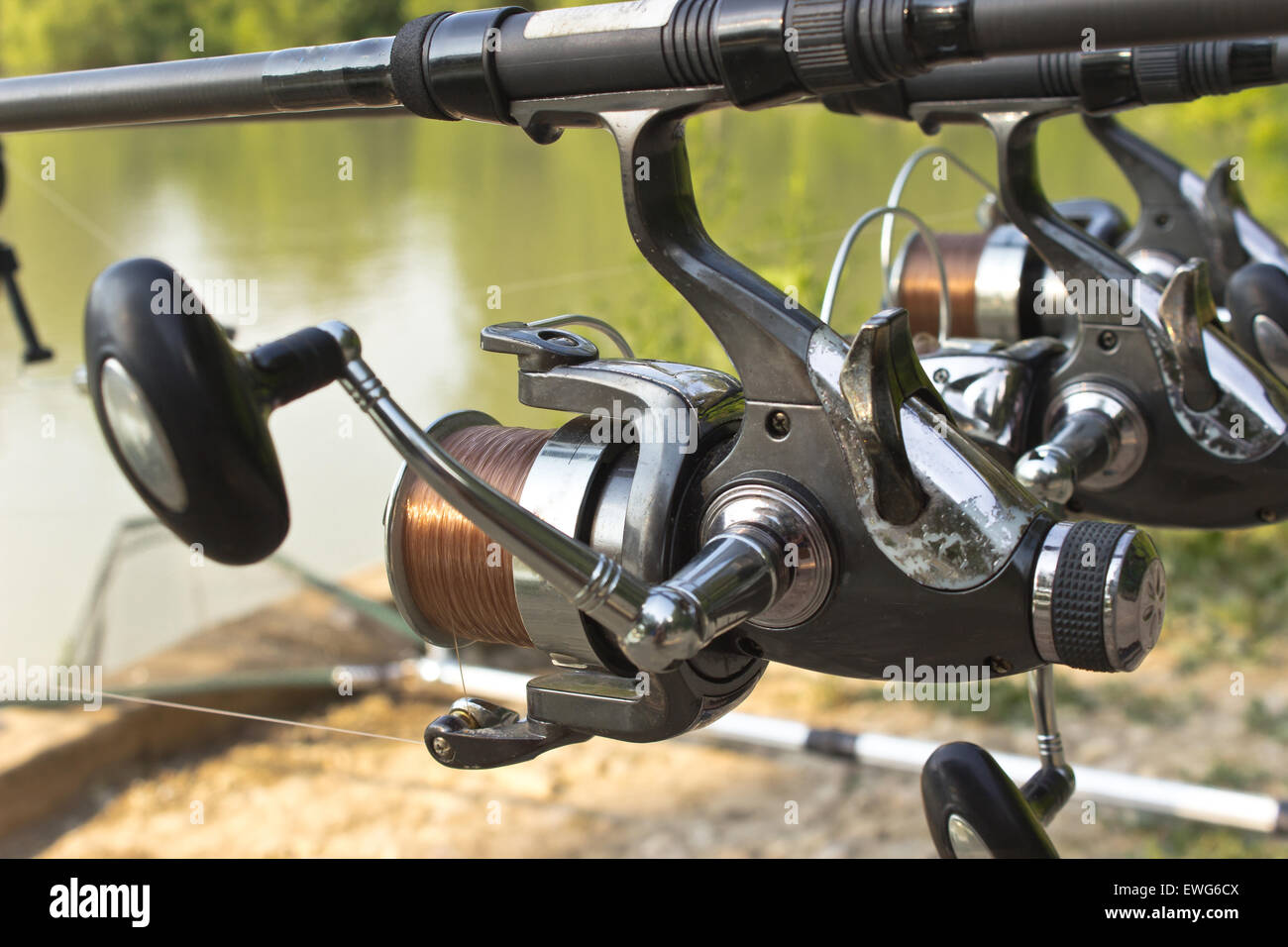 Fishing rod and reel under water Stock Photo - Alamy