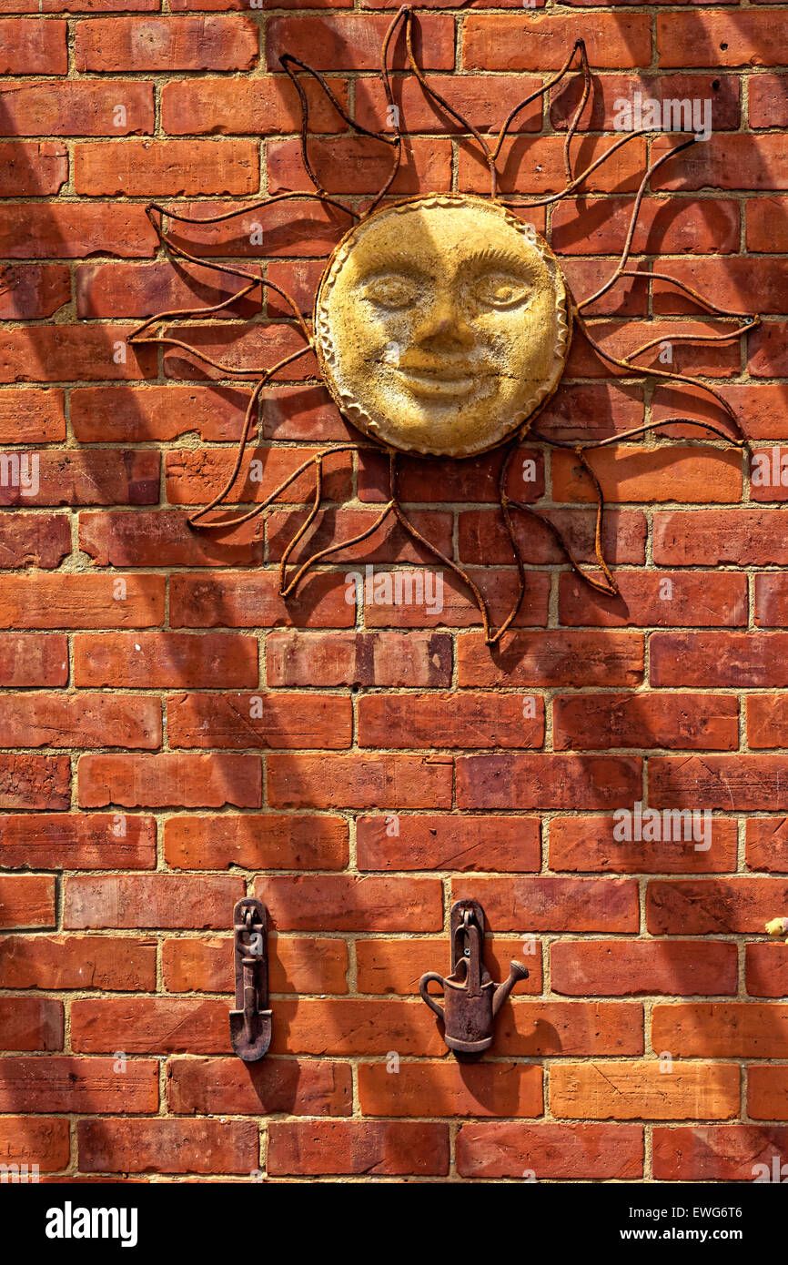 Artistic impression of the sun hanging on wall Stock Photo - Alamy