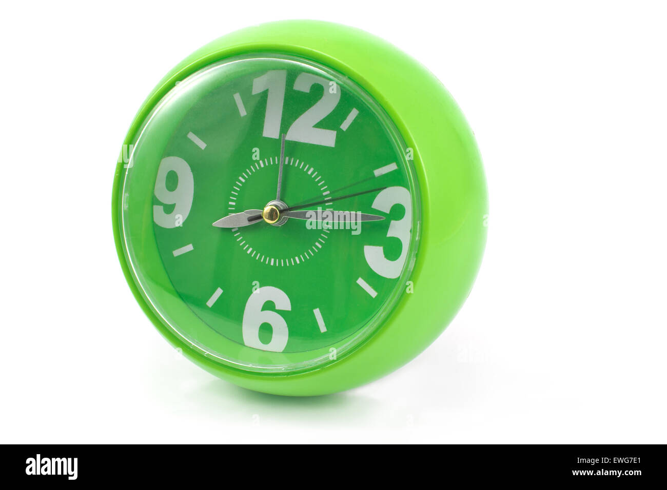 Green clock on white Stock Photo - Alamy