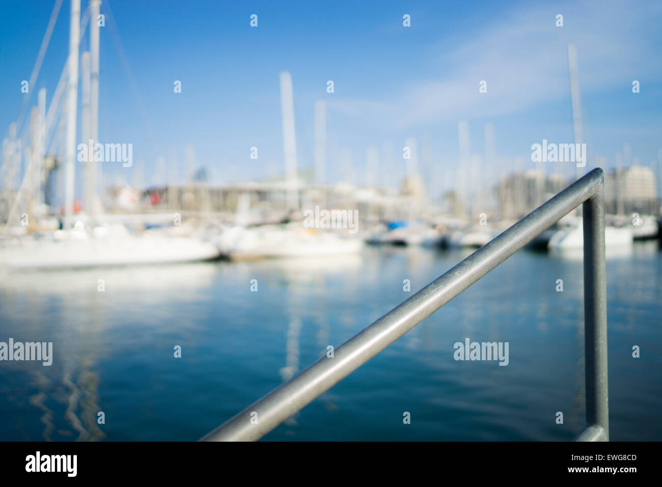 A railing at Barcelona port with yachts Stock Photo - Alamy