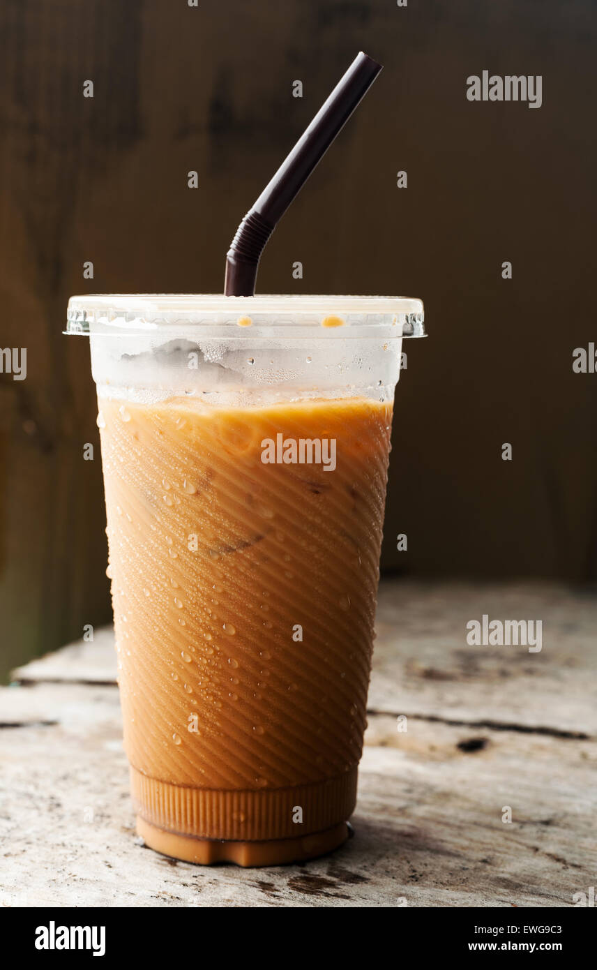 Ice milk tea, famous drink on old wood table, Grunge background Stock ...