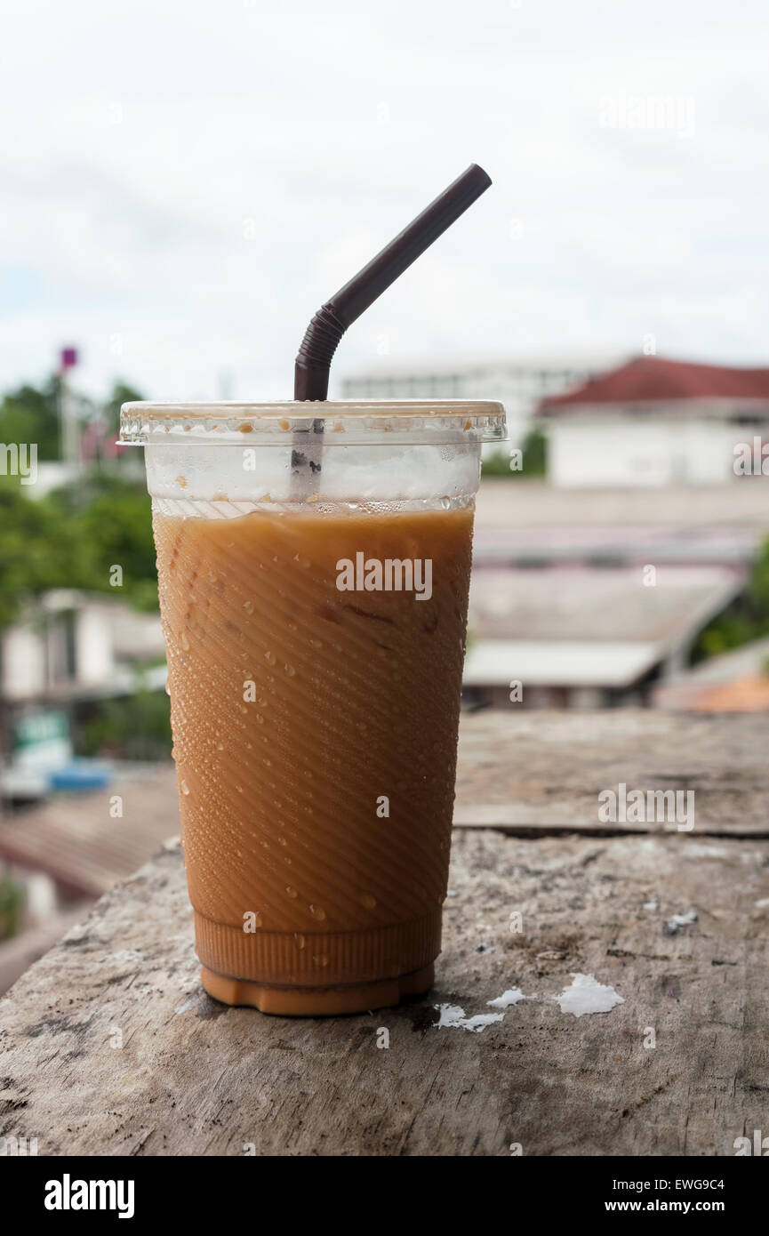 Ice milk tea, famous drink on old wood table, City background Stock ...