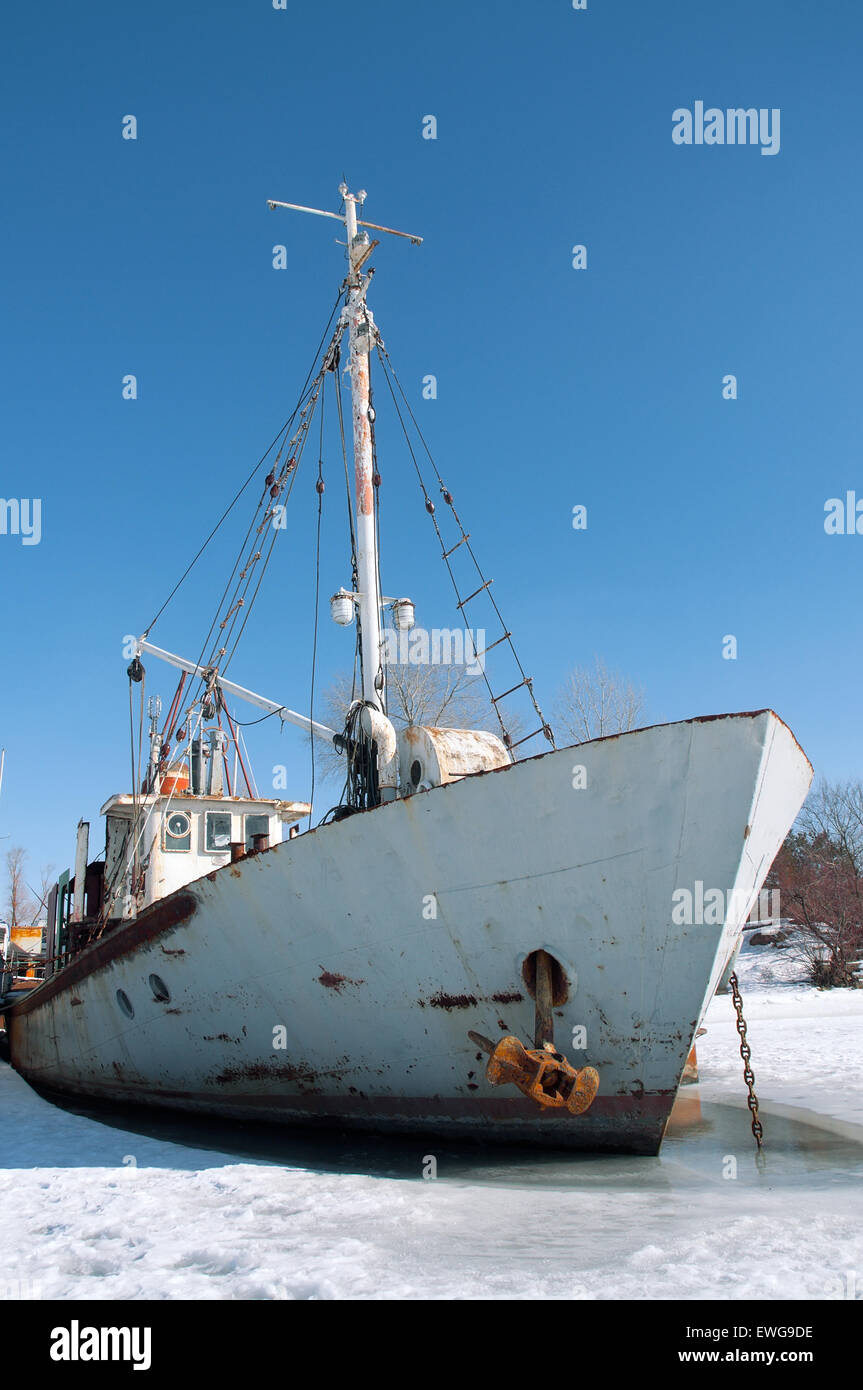 Old ship in the ice on a winter park Stock Photo - Alamy