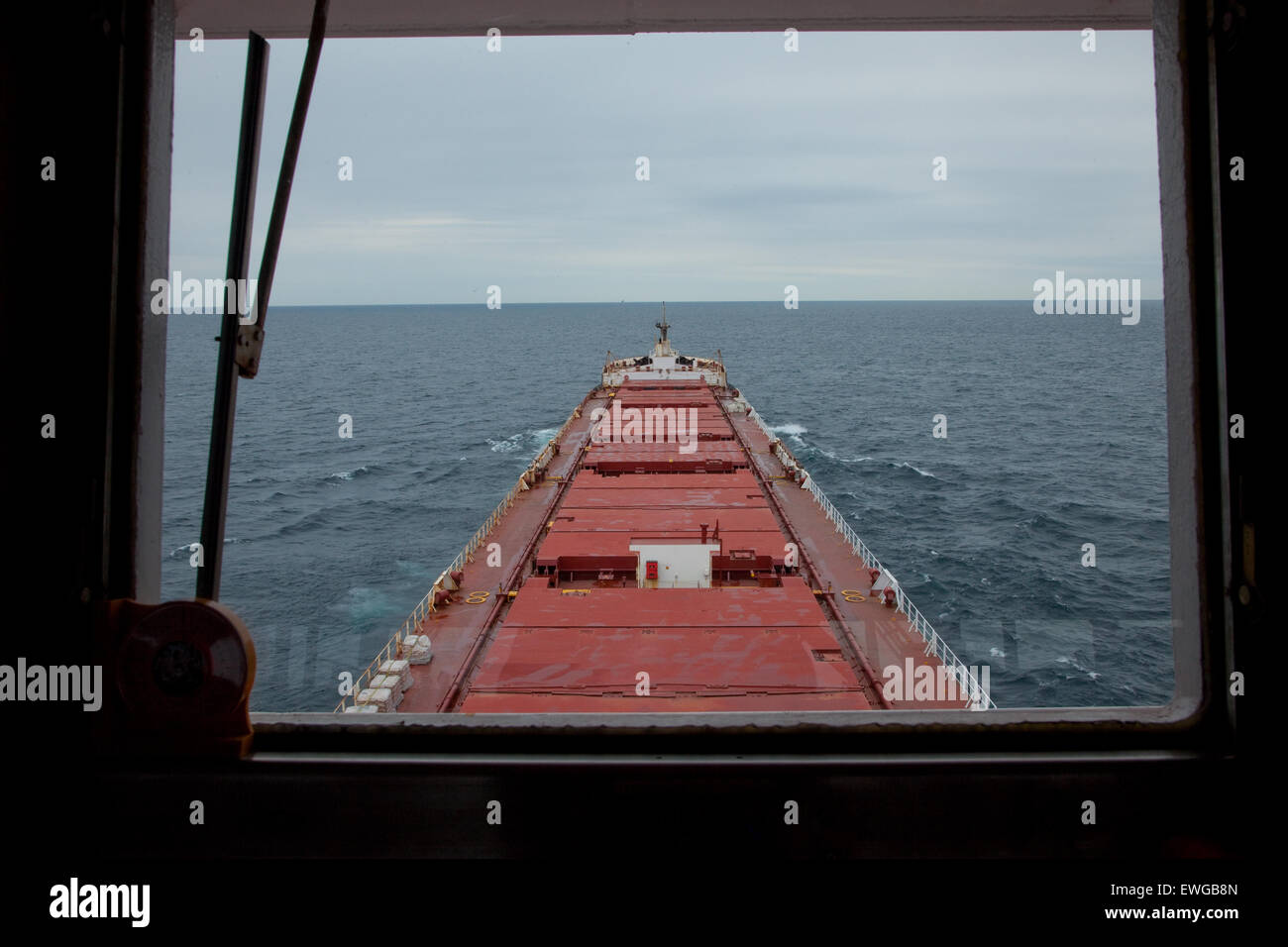 bulk laker ship underway through bridge window Stock Photo - Alamy