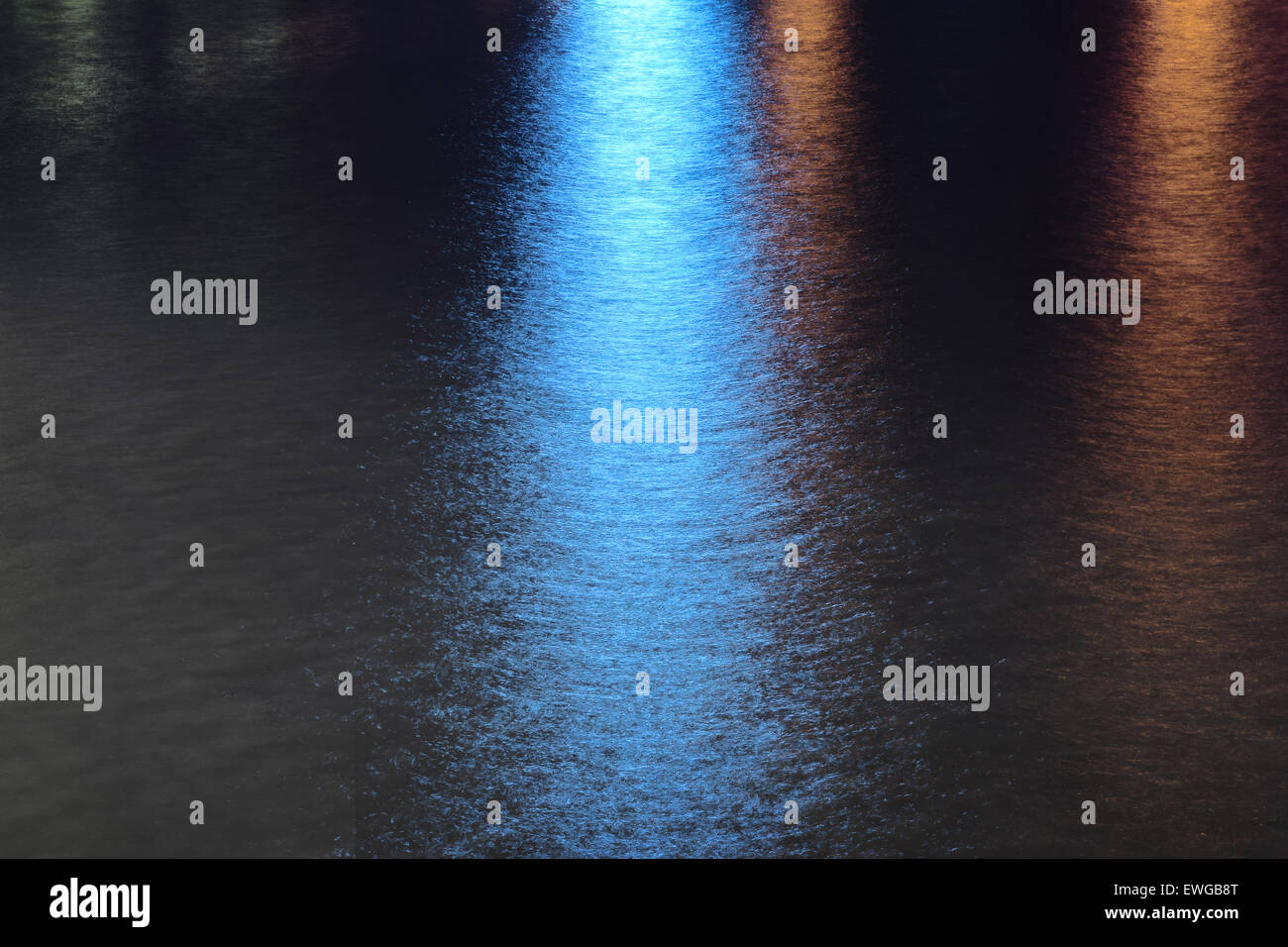 Abstract blue light reflecting on the water at night Stock Photo - Alamy