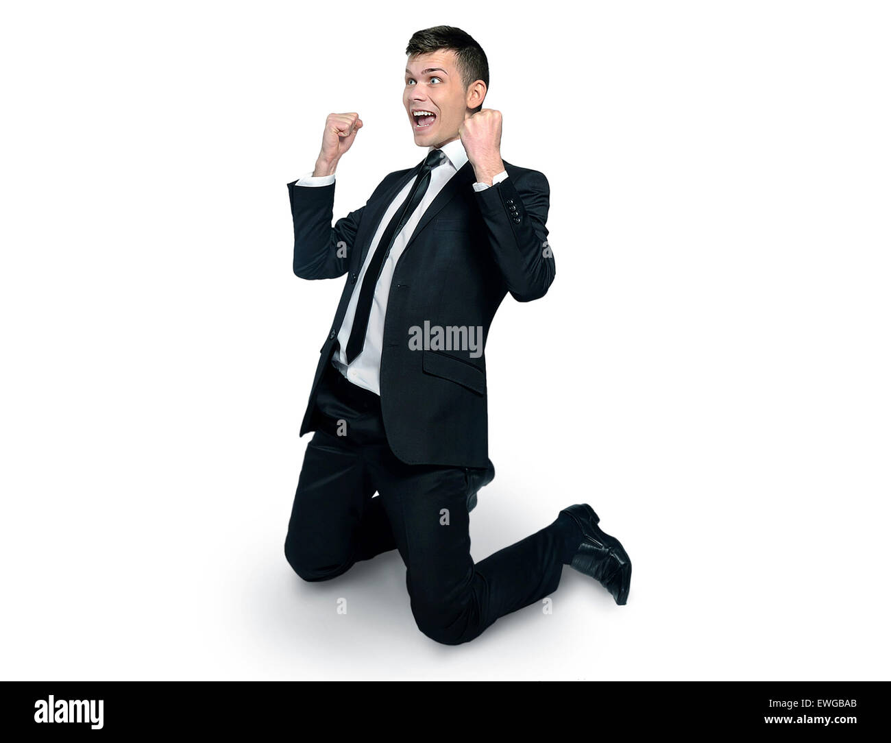 Business man winning with hands up Stock Photo - Alamy