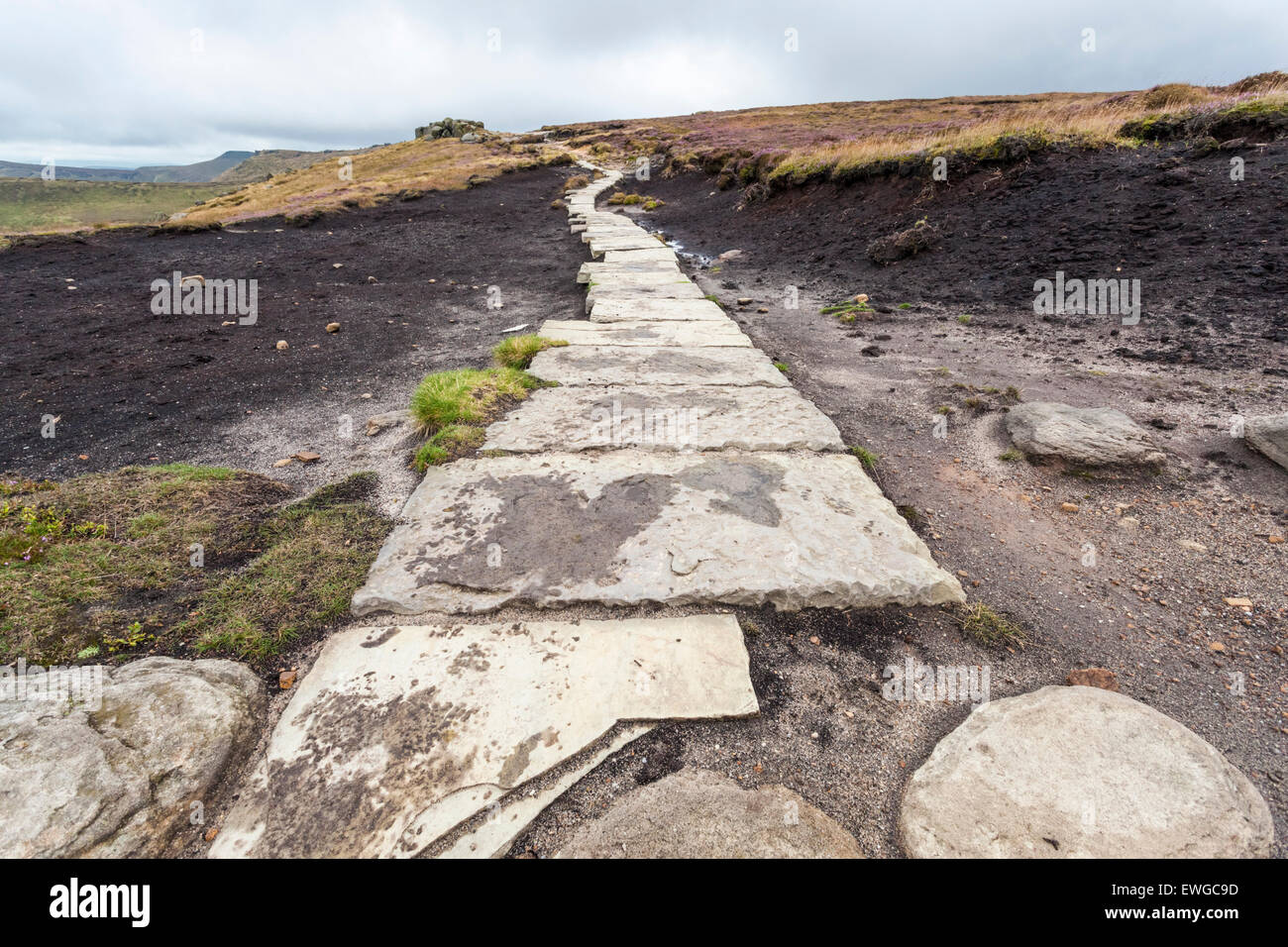 Moors conservation. A stone footpath across badly eroded moorland on ...