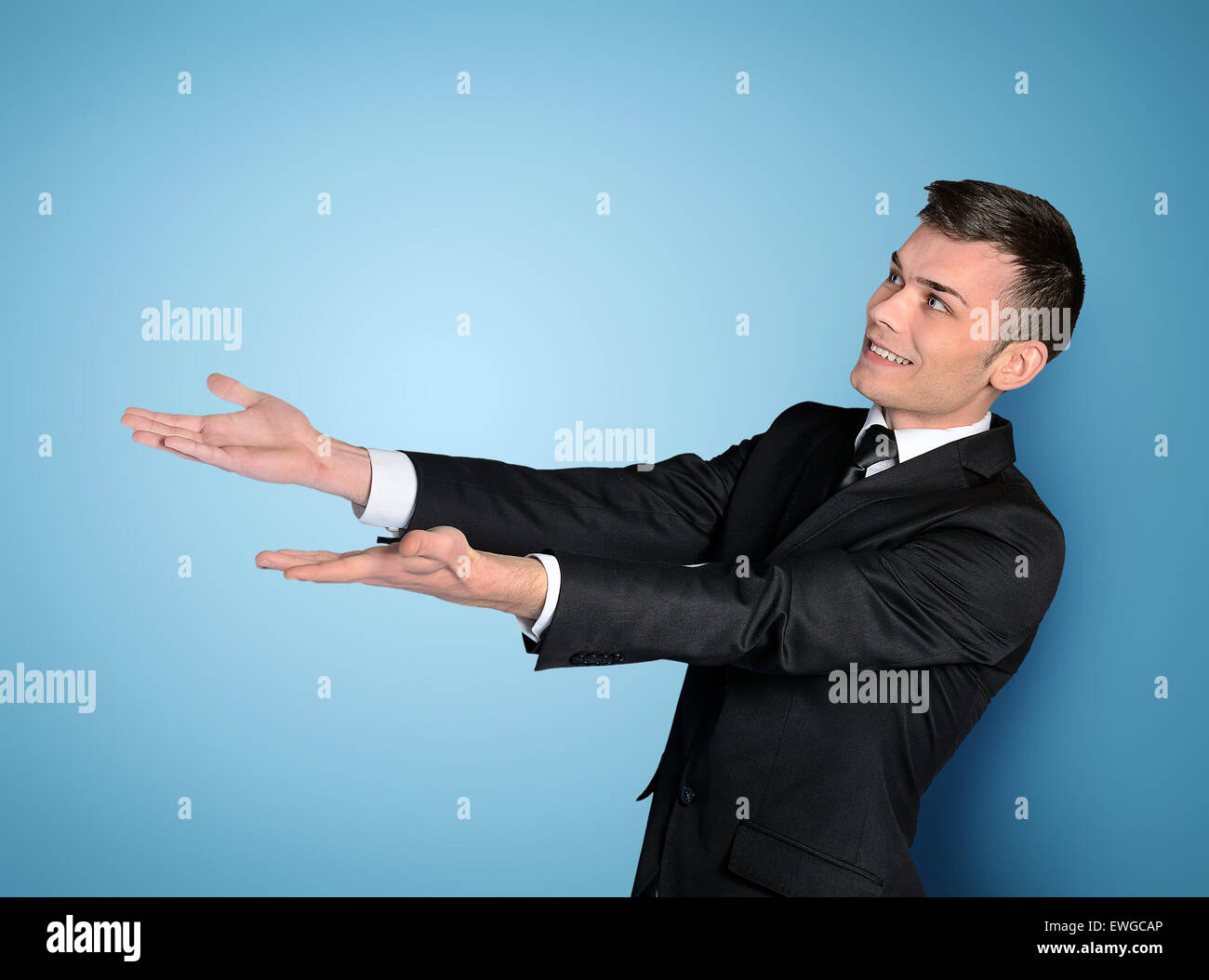 Business man offering something Stock Photo - Alamy