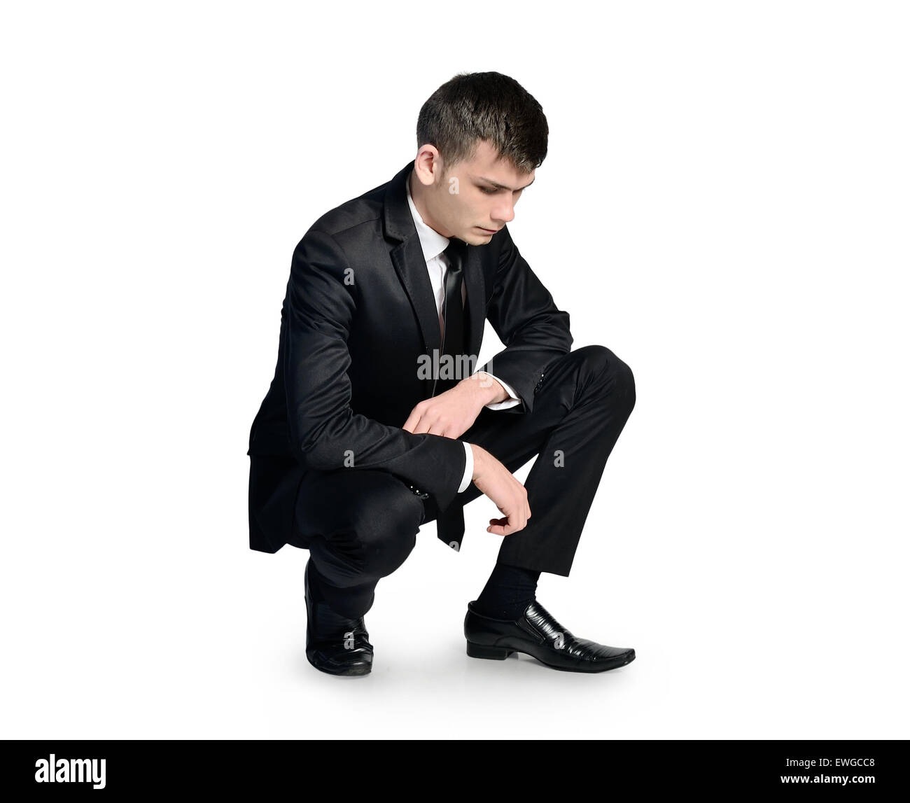 Business man looking down at something Stock Photo - Alamy