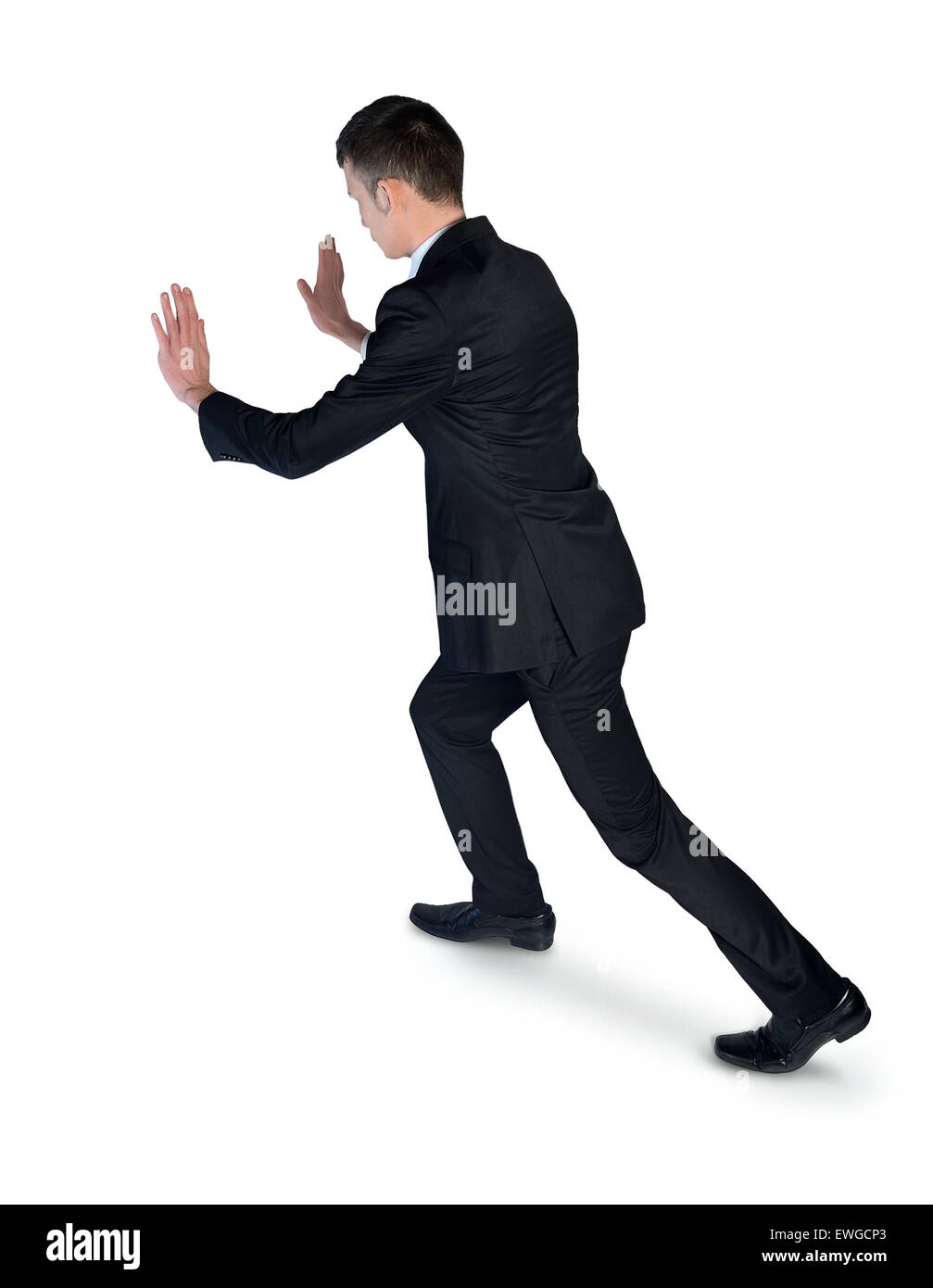 Isolated business man pushing something Stock Photo - Alamy