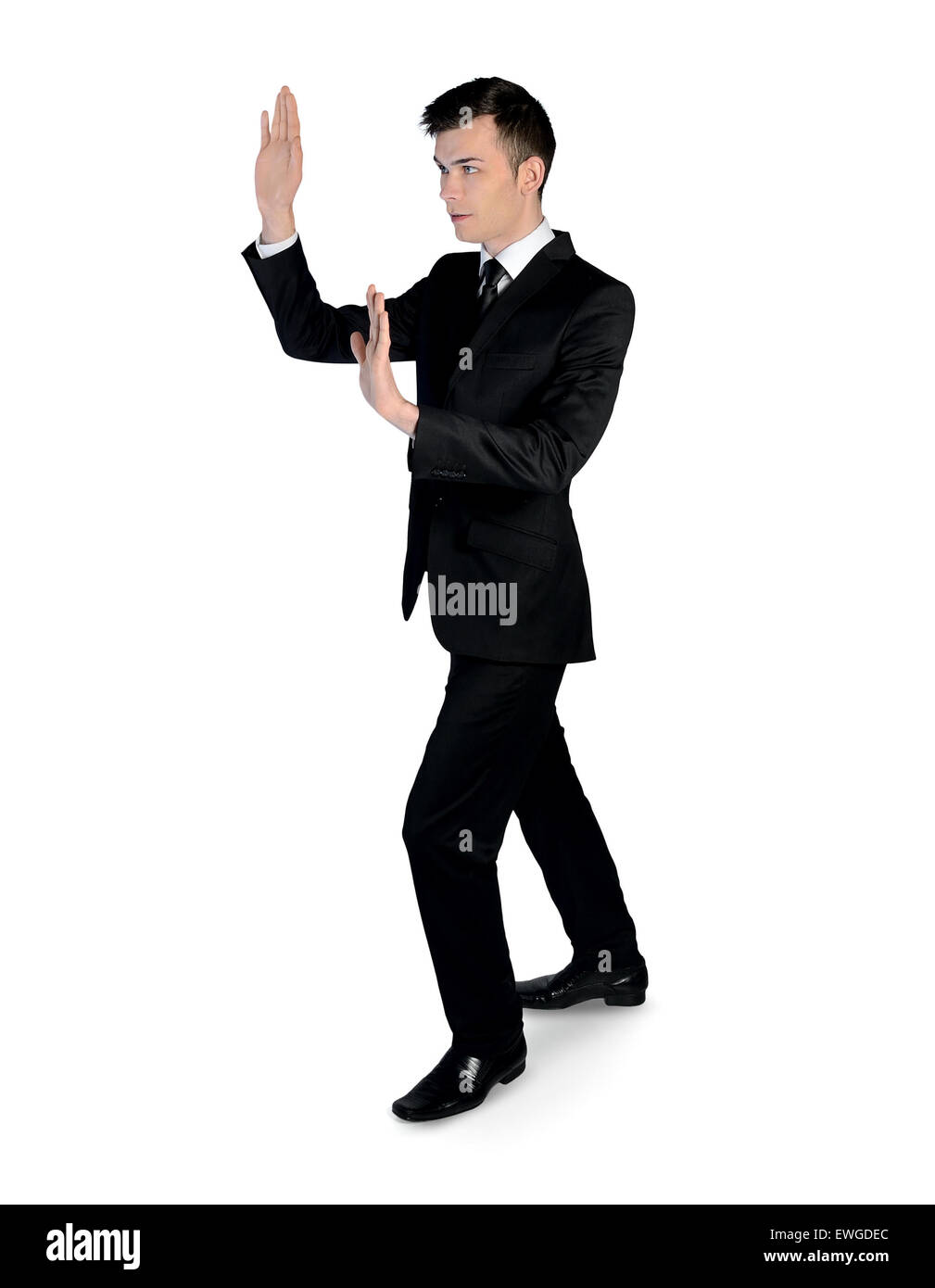 Isolated business man push something Stock Photo - Alamy