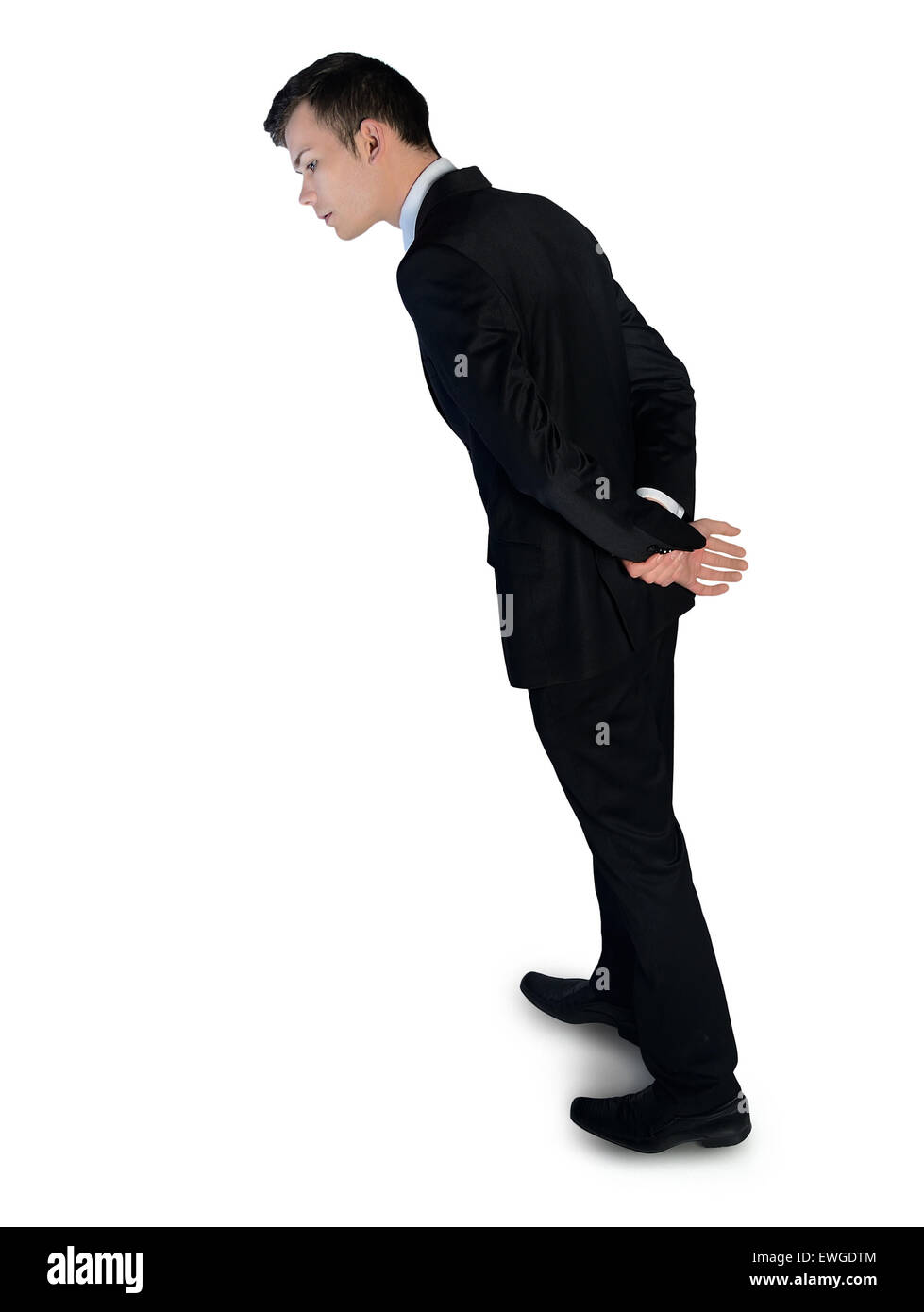 Isolated business man inspecting something Stock Photo - Alamy