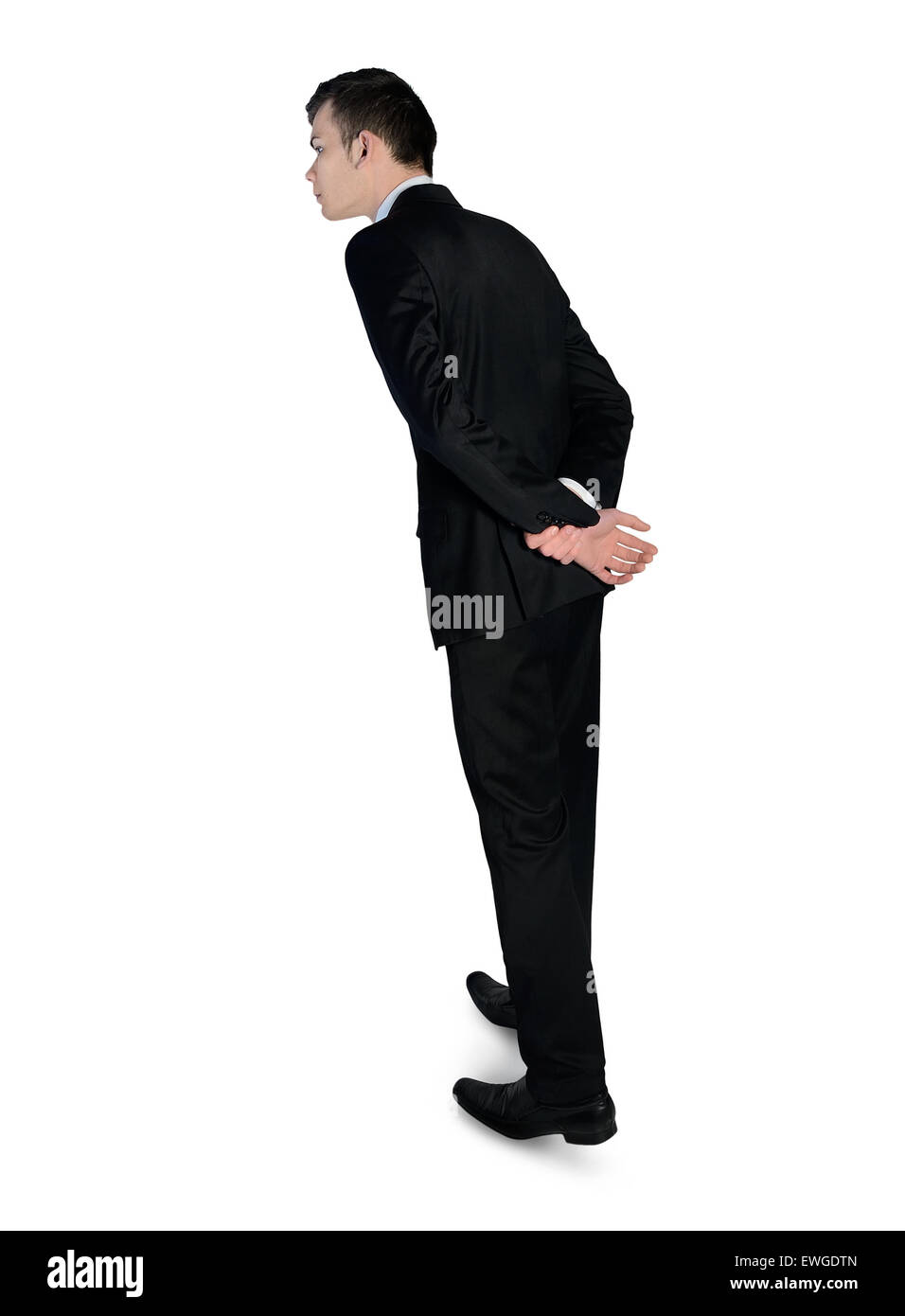 Isolated business man looking back Stock Photo - Alamy
