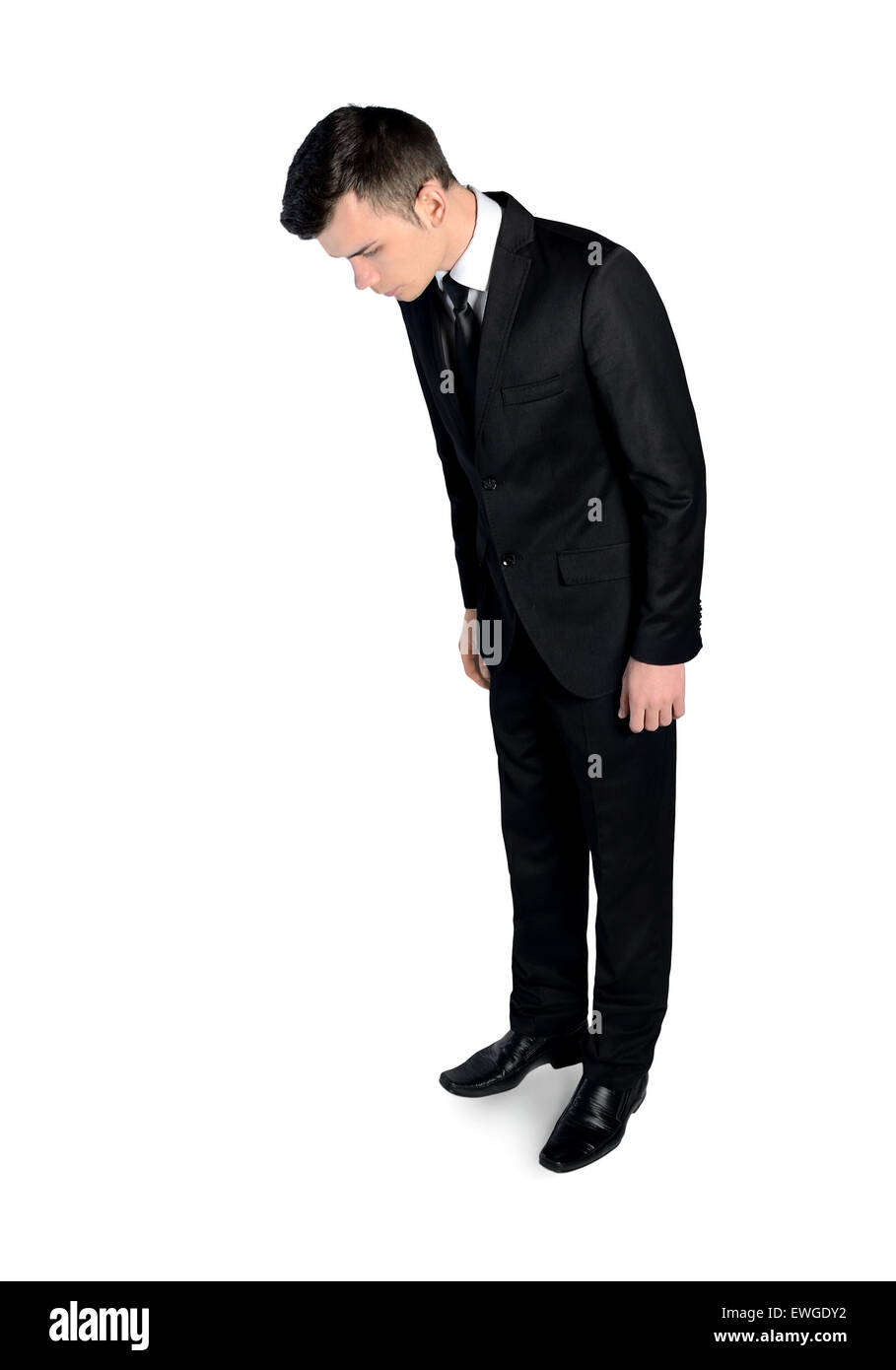 Isolated business man looking down Stock Photo - Alamy