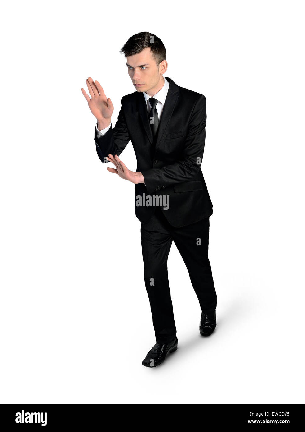 Isolated business man push something Stock Photo - Alamy