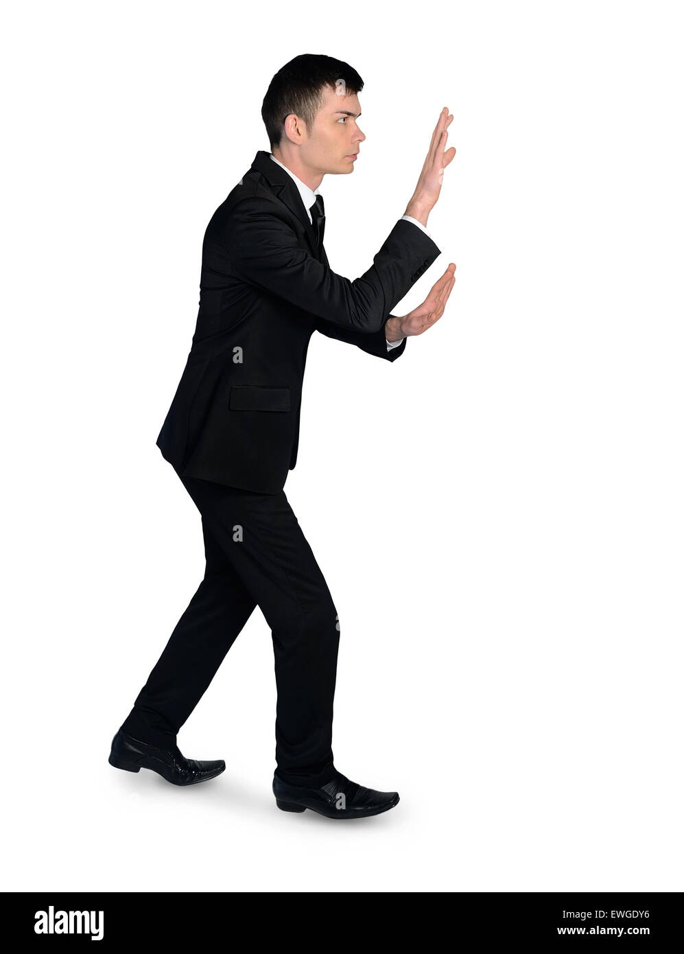 Isolated business man push something Stock Photo - Alamy