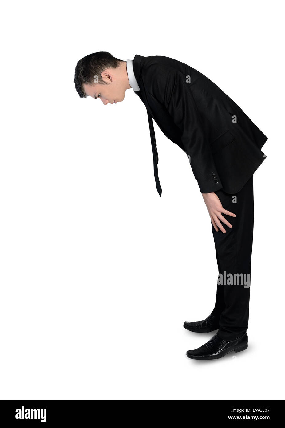 Isolated business man looking down Stock Photo - Alamy