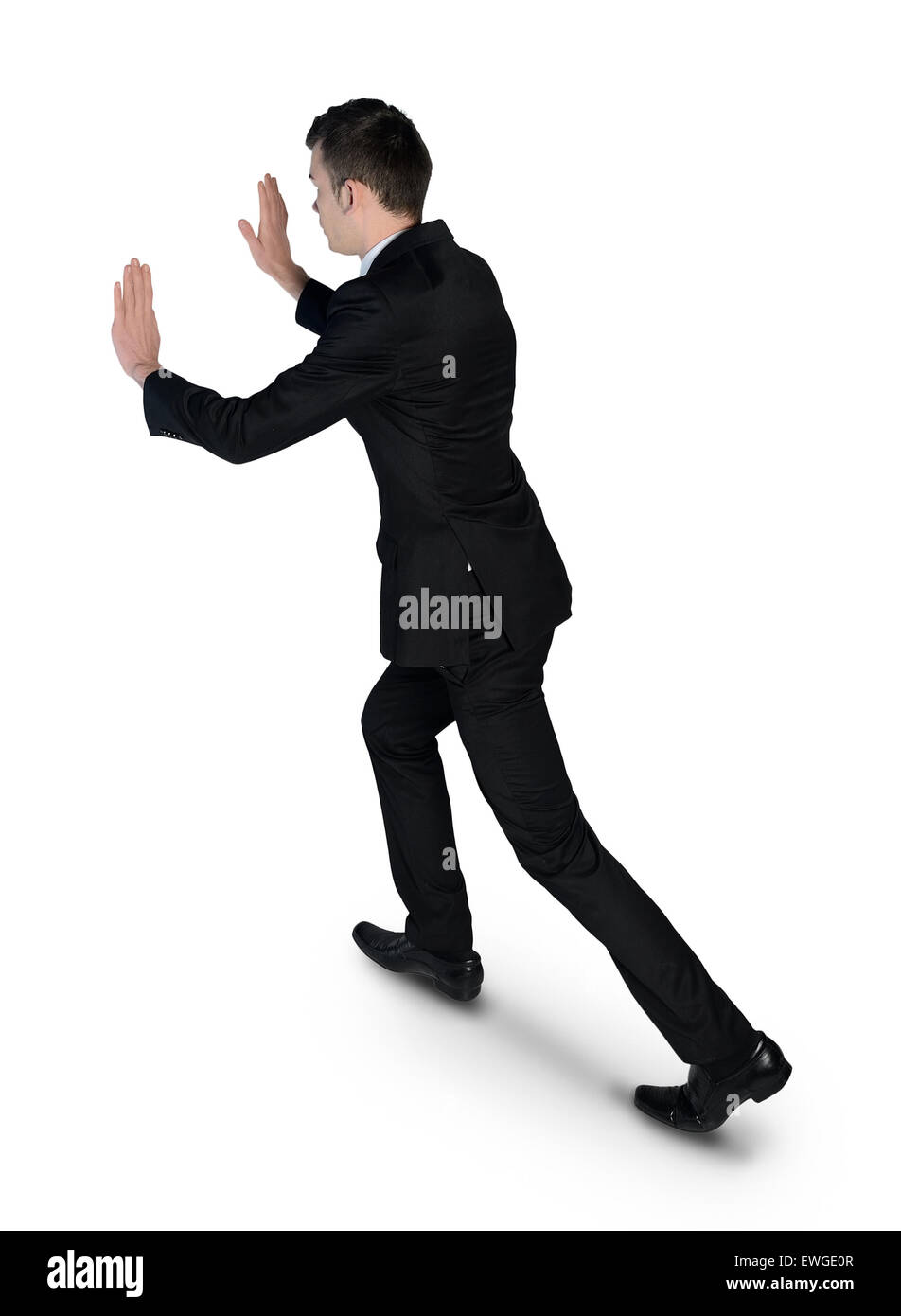 Isolated business man push something Stock Photo - Alamy
