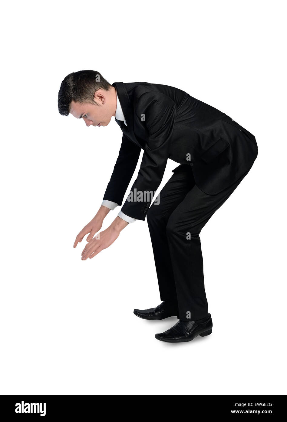 Isolated business man push something down Stock Photo - Alamy