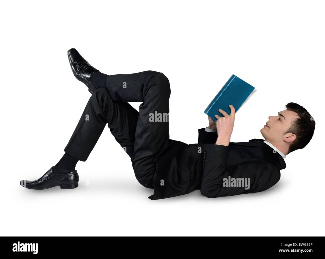 Young man relaxing reading Cut Out Stock Images & Pictures - Alamy