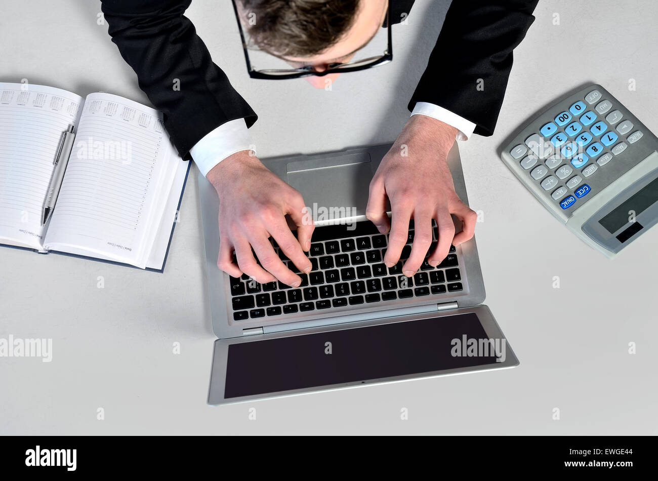 Business man writing at laptop Stock Photo - Alamy